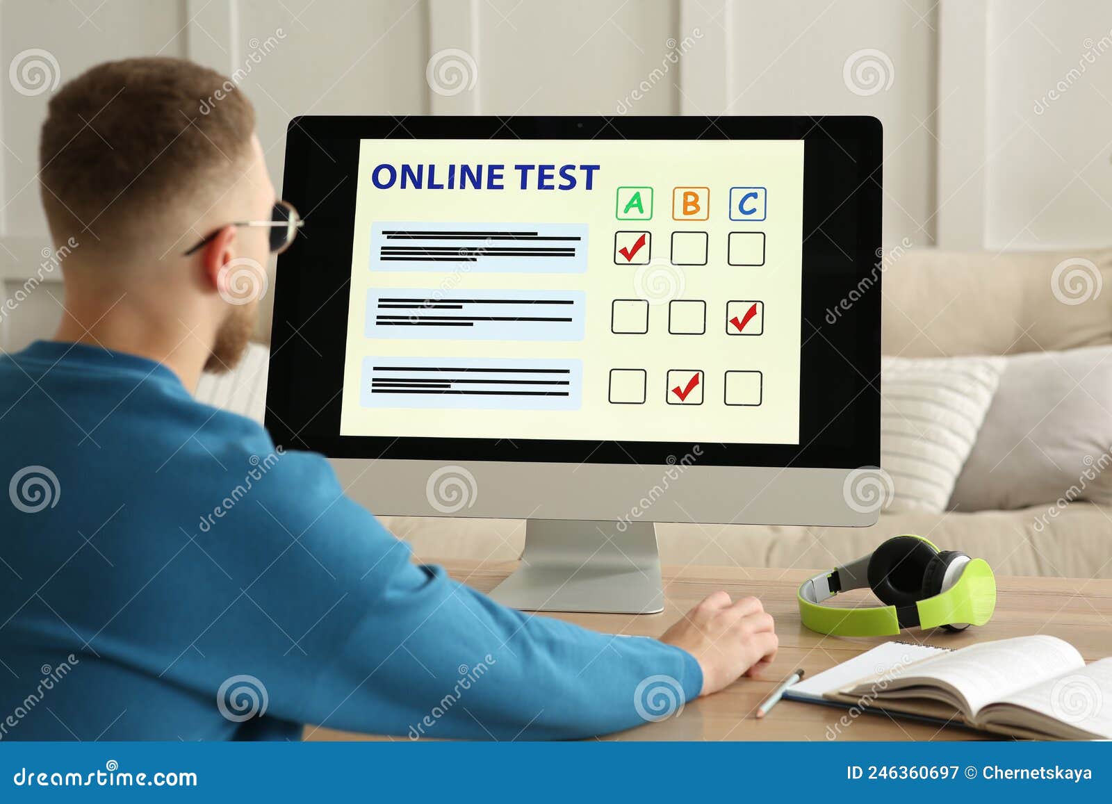 Man Taking Online Test on Computer at Desk Indoors Stock Image - Image ...