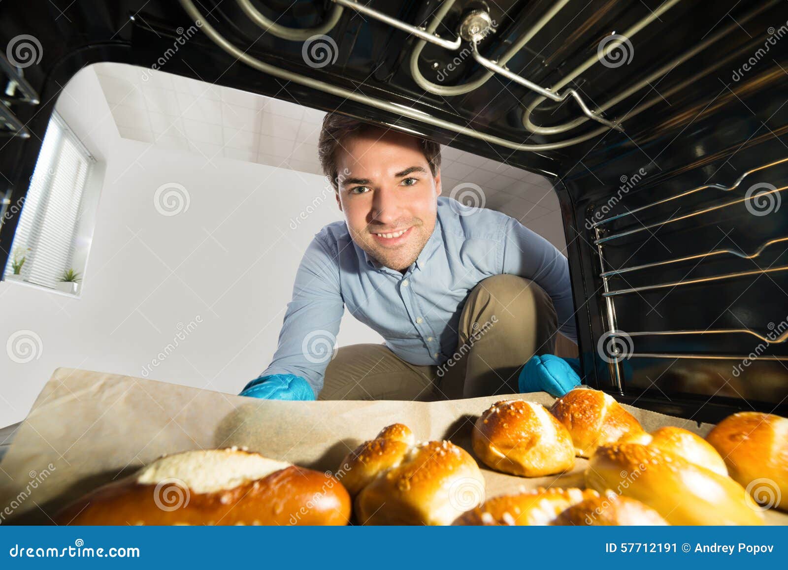 Man Taking Out Bread View from Inside the Oven Stock Image - Image of ...