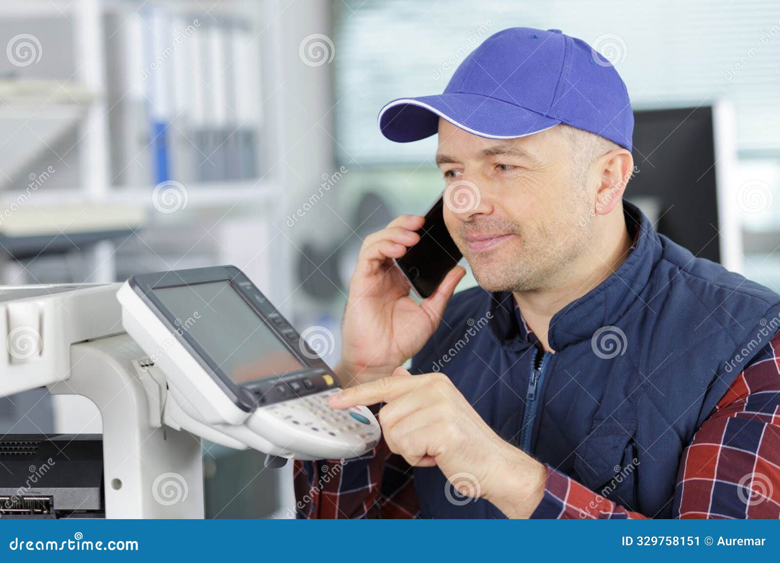 Man Taking Phone Call while Checking Printer Stock Image - Image of ...