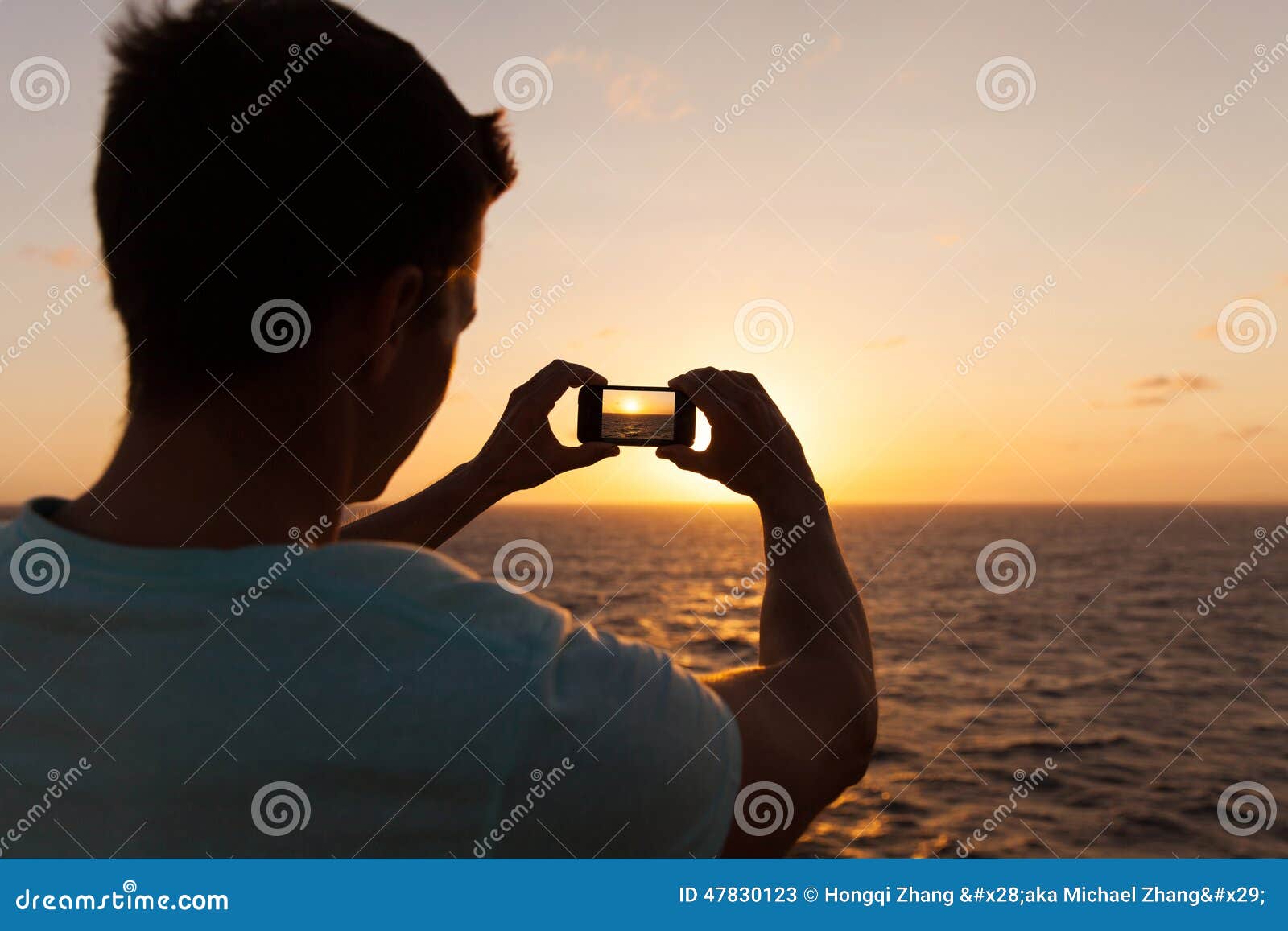 Man taking picture sunset stock image. Image of phone - 47830123