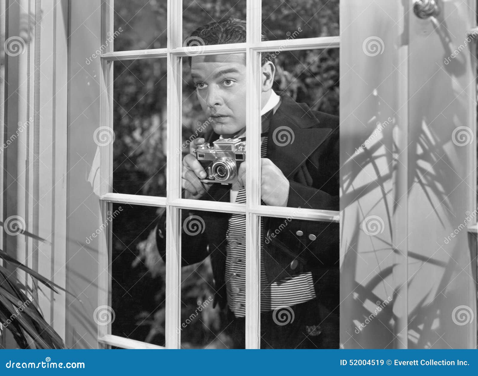 Man Taking Pictures through Window Stock Image - Image of hide, hidden ...