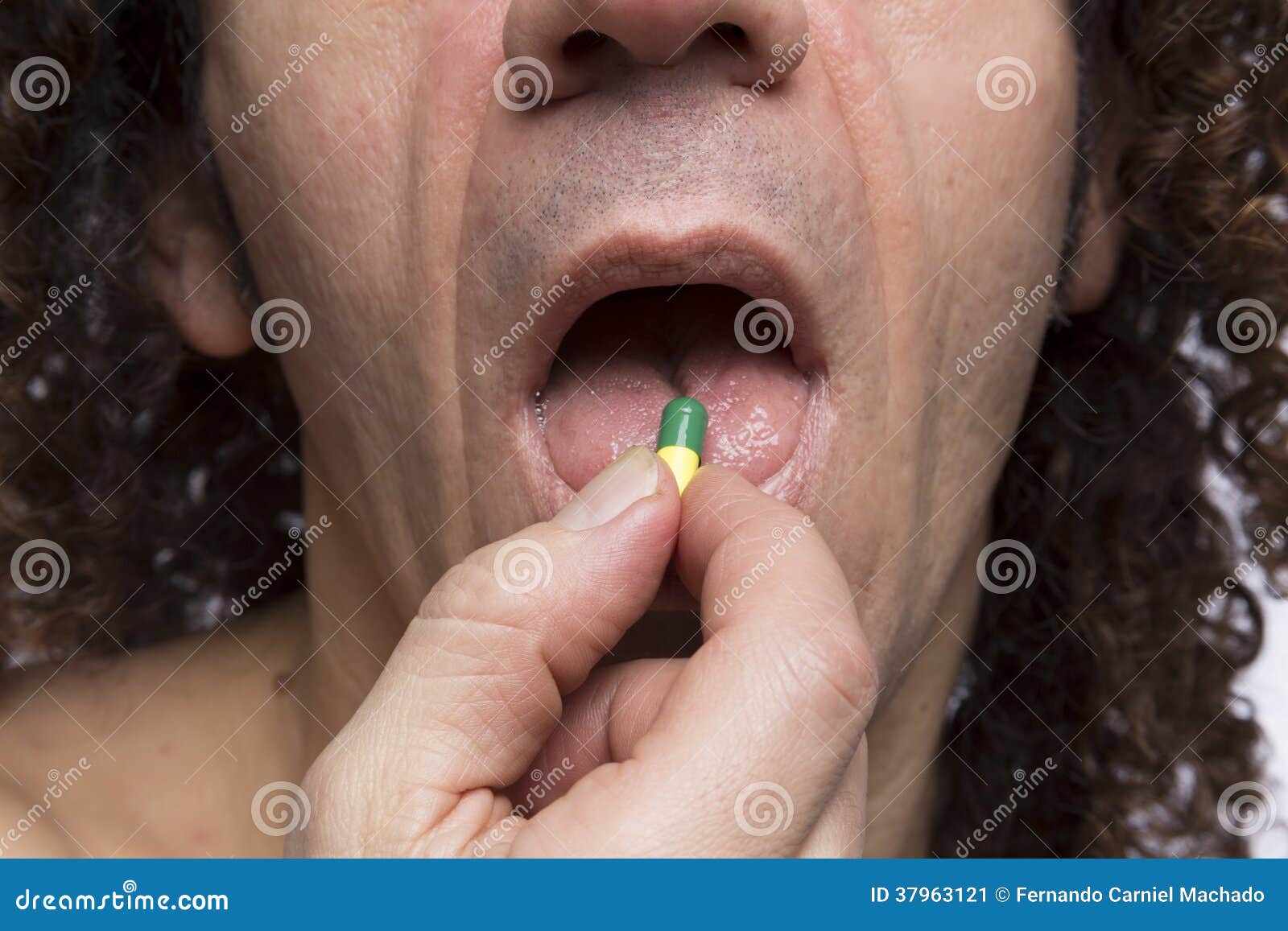 Man taking pill stock image. Image of portrait, health - 37963121