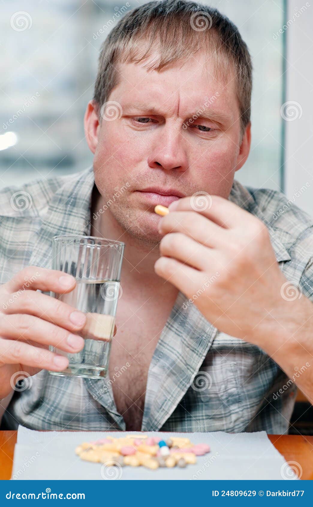 Man taking pills stock image. Image of health, palm, indoor - 24809629