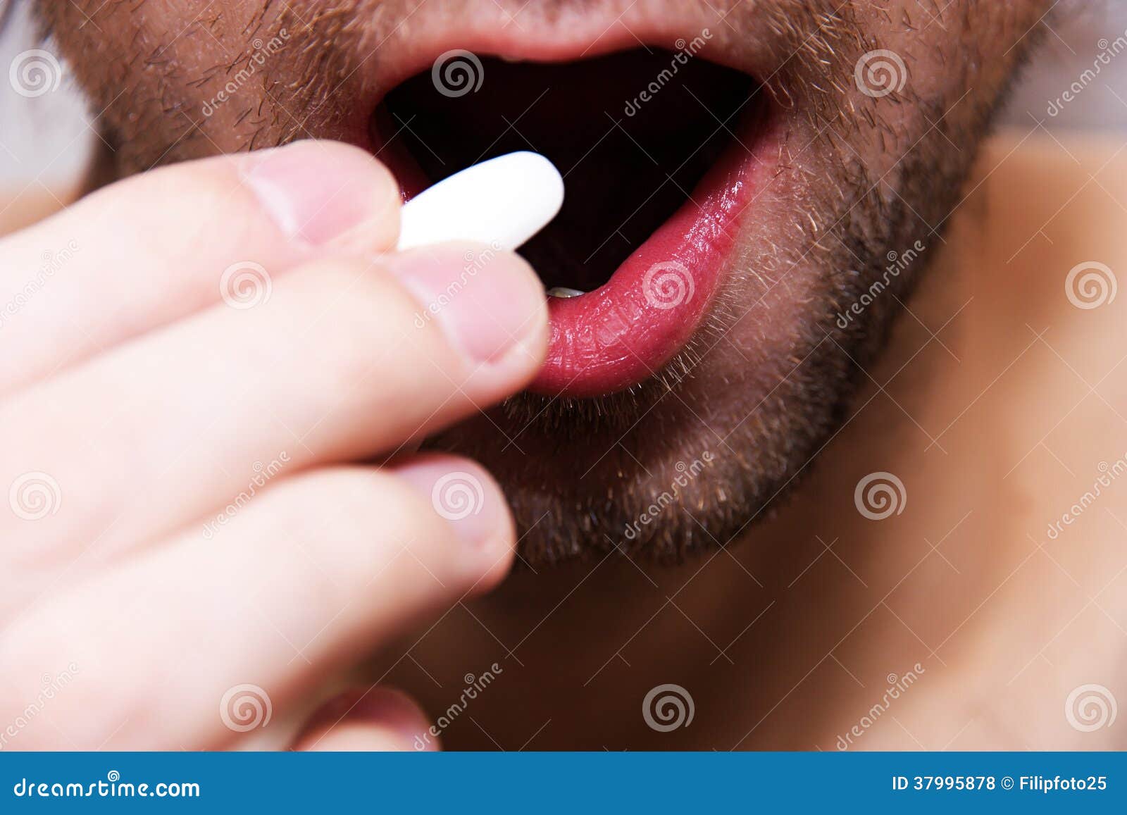 Man taking pills stock photo. Image of frowning, home - 37995878