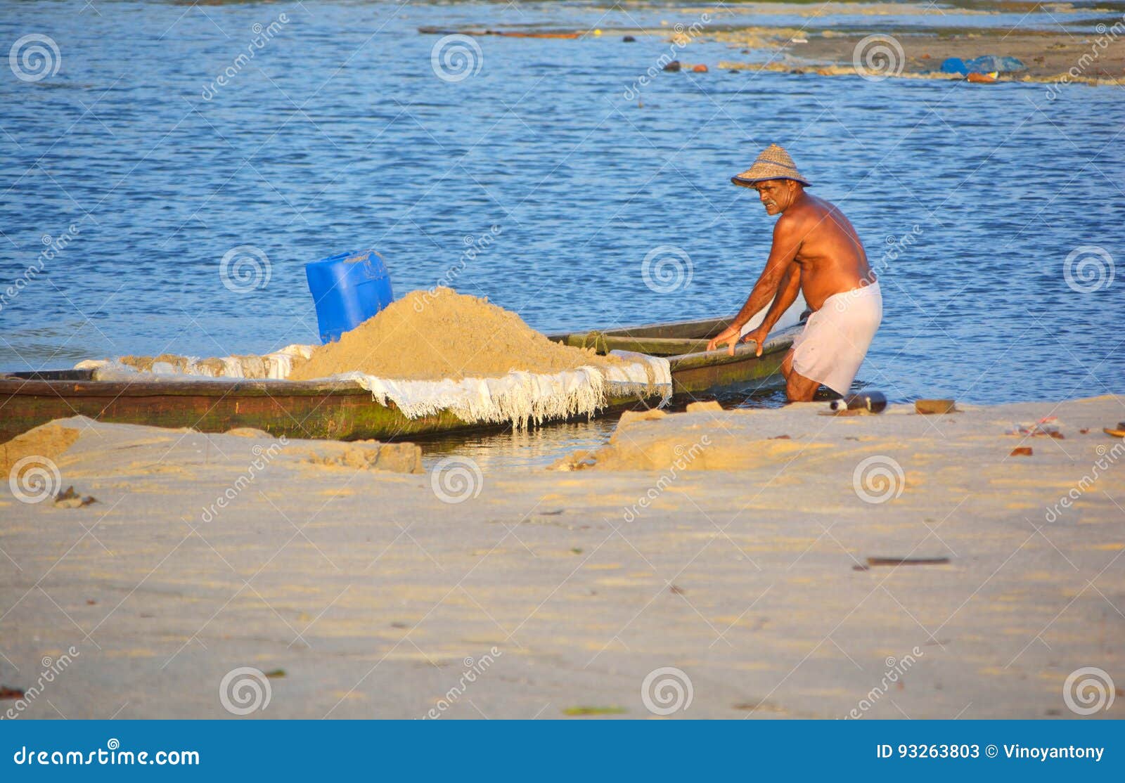 Man taking sand on boat editorial stock photo. Image of seashore - 93263803