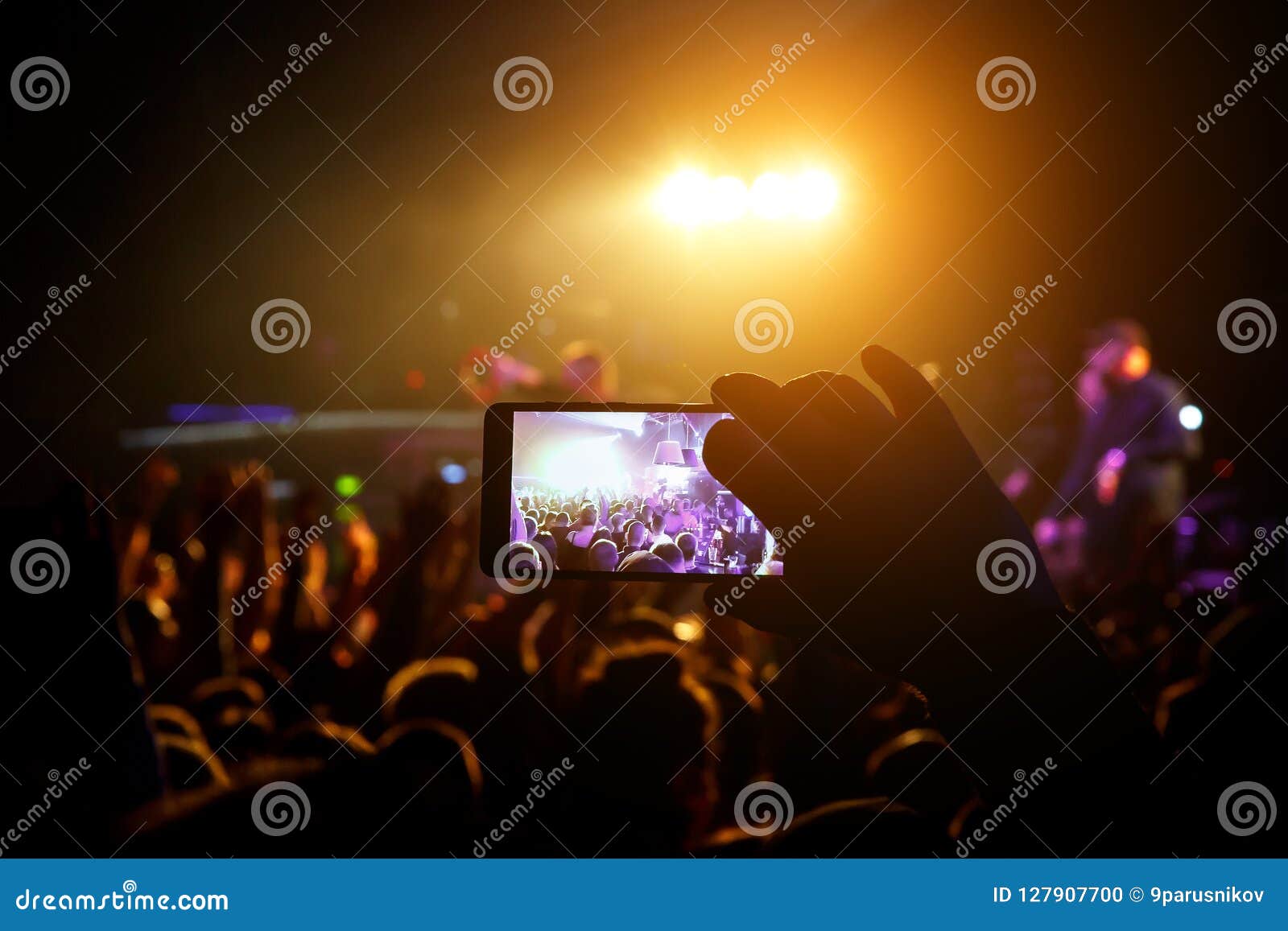 Man Taking Smart Phone at Live Concert and Lights on Stage Stock Photo ...