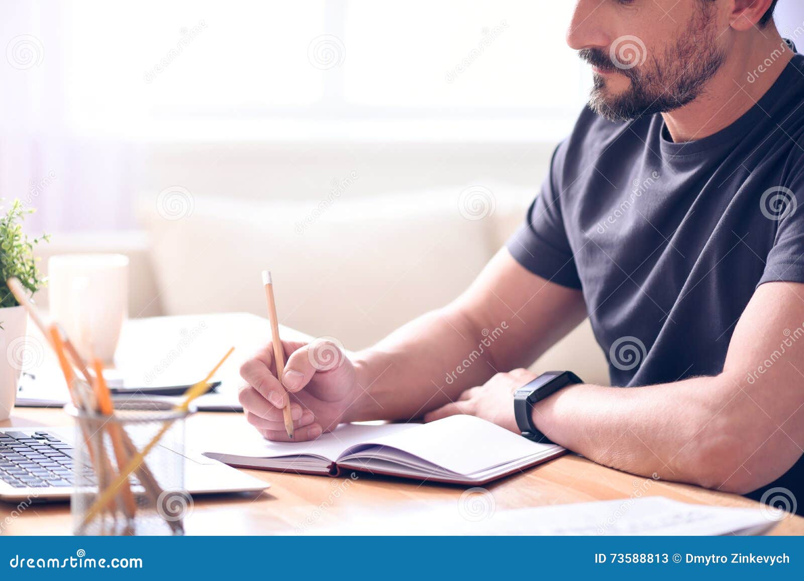Man Taking Some Notes while Sitting Stock Image - Image of discerning ...