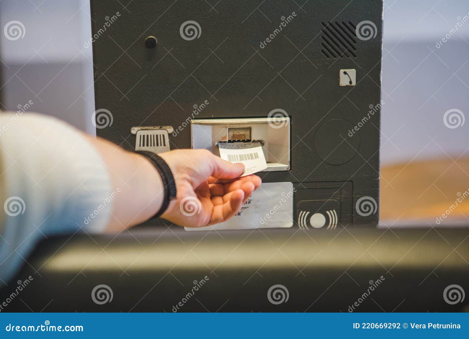 Man Taking Ticket in Front of Underground Parking Barrier Stock Photo ...