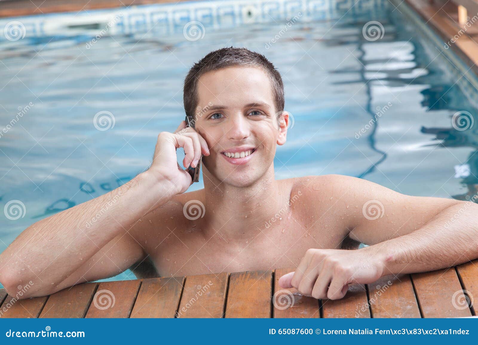 Man Talking on Cell Inside the Pool Stock Photo - Image of model ...