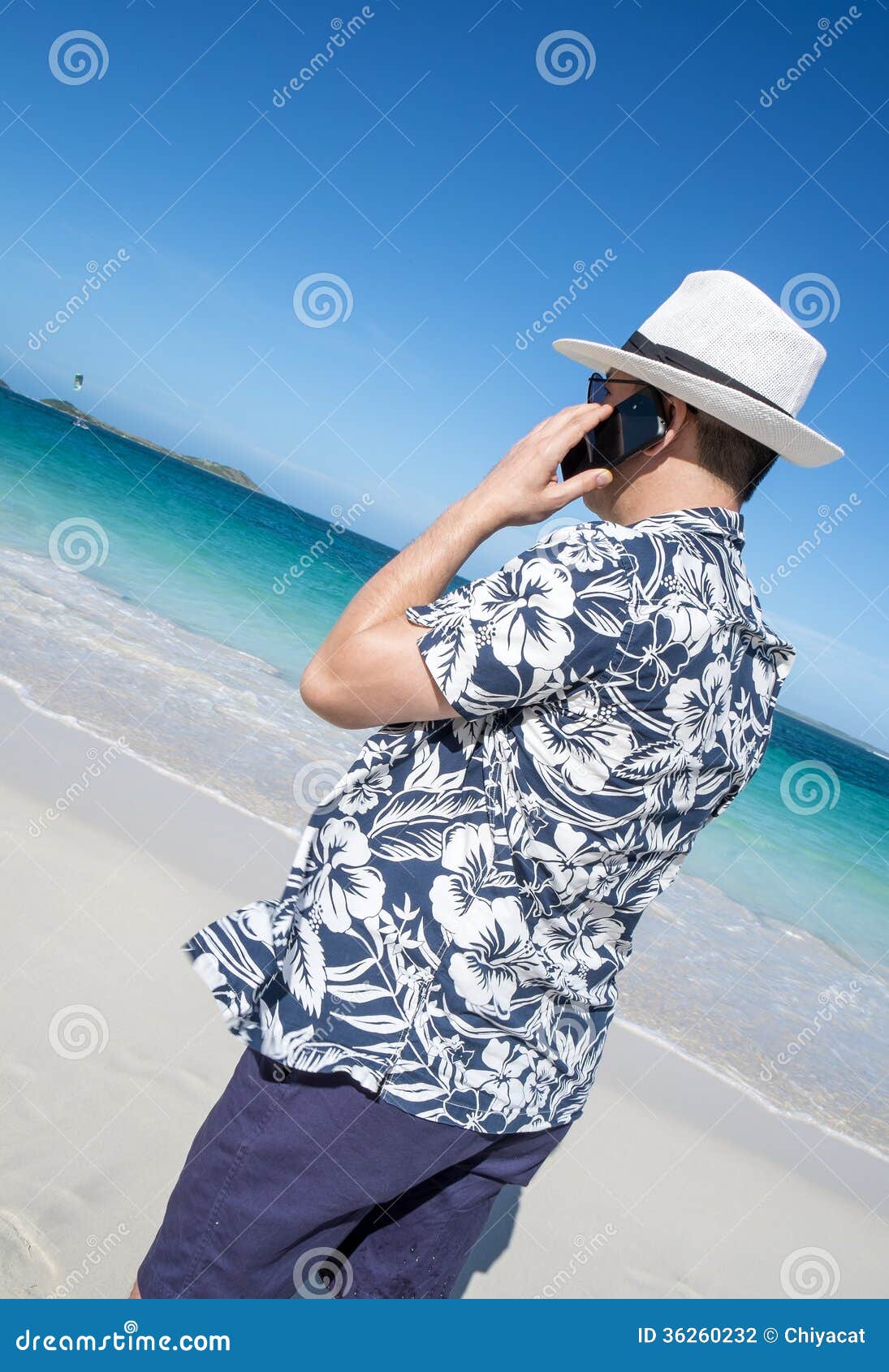 Man Talking on a Cellphone on a Caribbean Beach Stock Photo - Image of ...