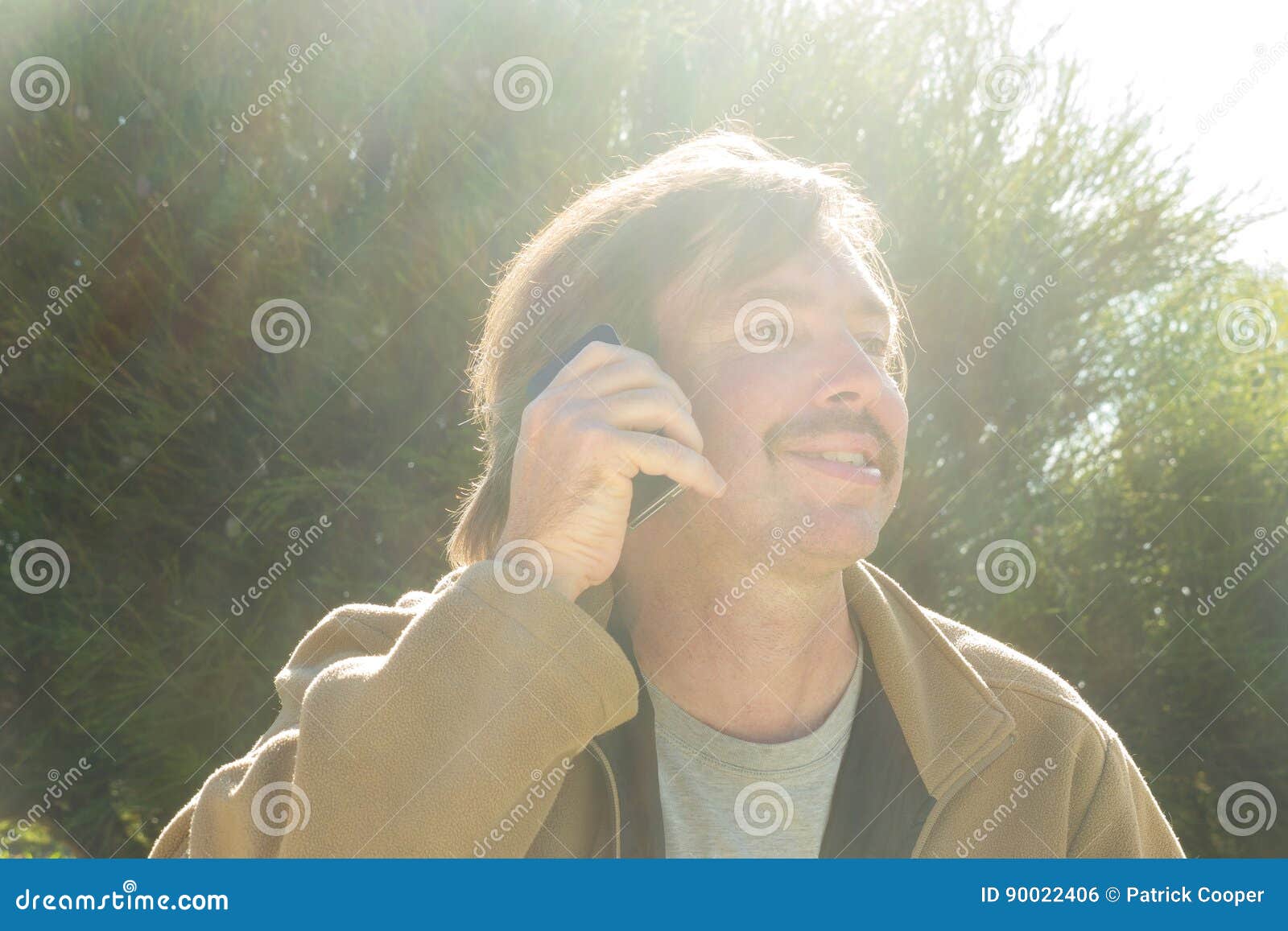 Man talking on phone stock photo. Image of gadget, flare - 90022406