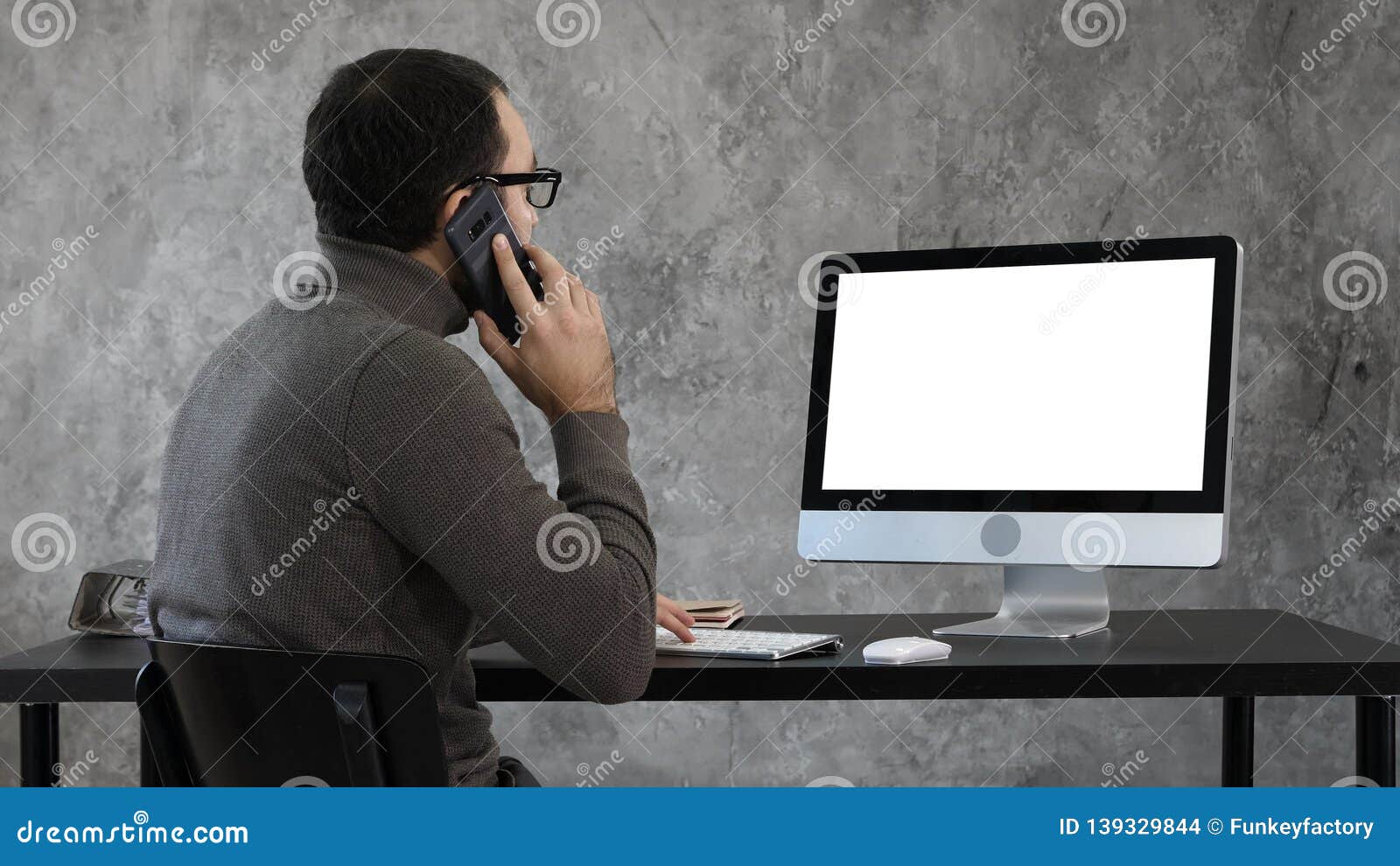 Man Talking on Phone in Office and Looking on Computer Screen. White ...