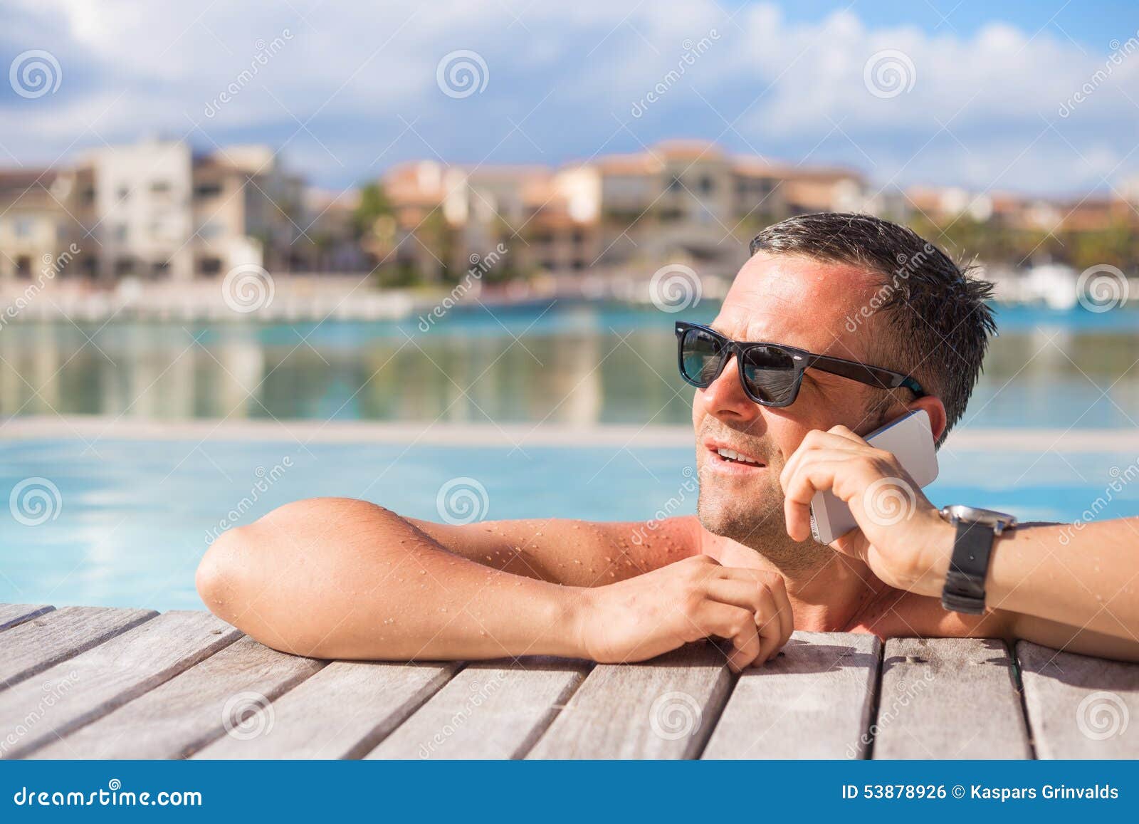Man Talking on Phone while Relaxing in the Swimming Pool Stock Photo ...