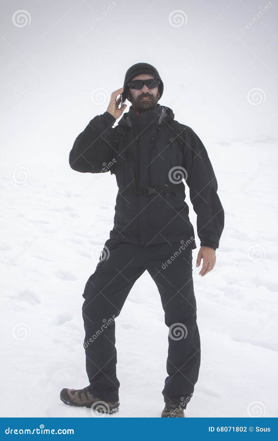 Man Talking on Phone in the Snowy Mountain Stock Photo - Image of ...