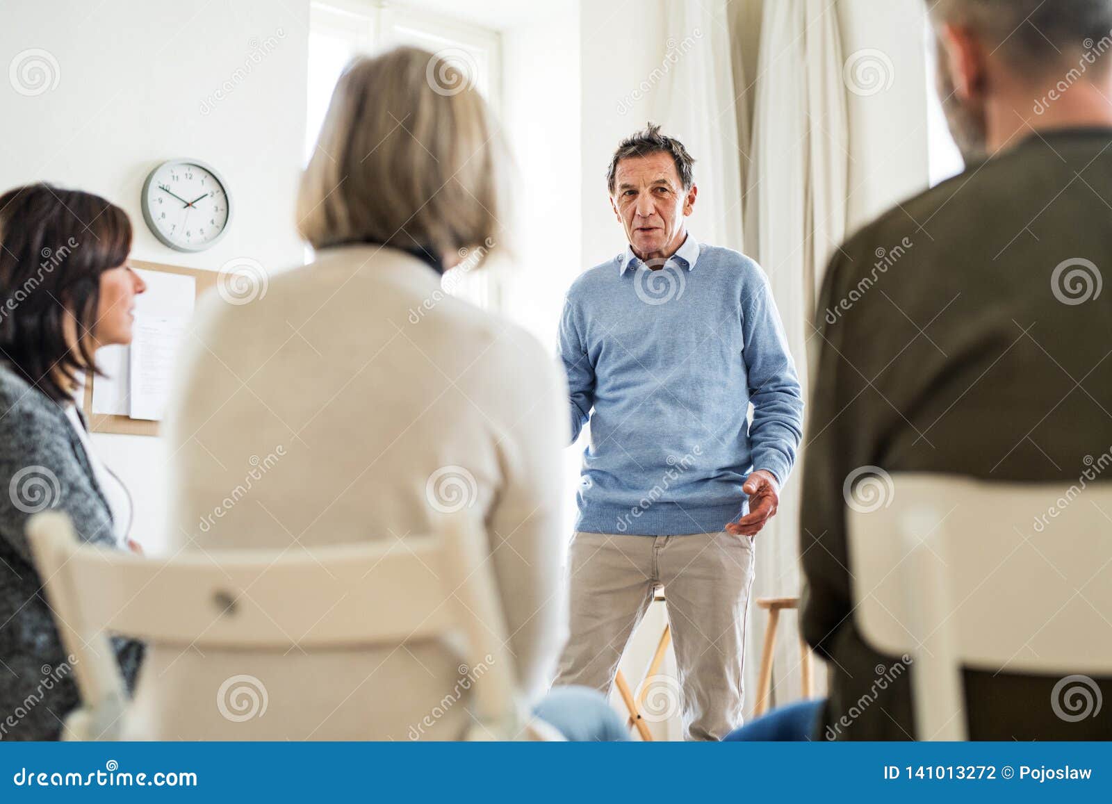 A Man Talking To Other People during Group Therapy. Stock Photo - Image ...