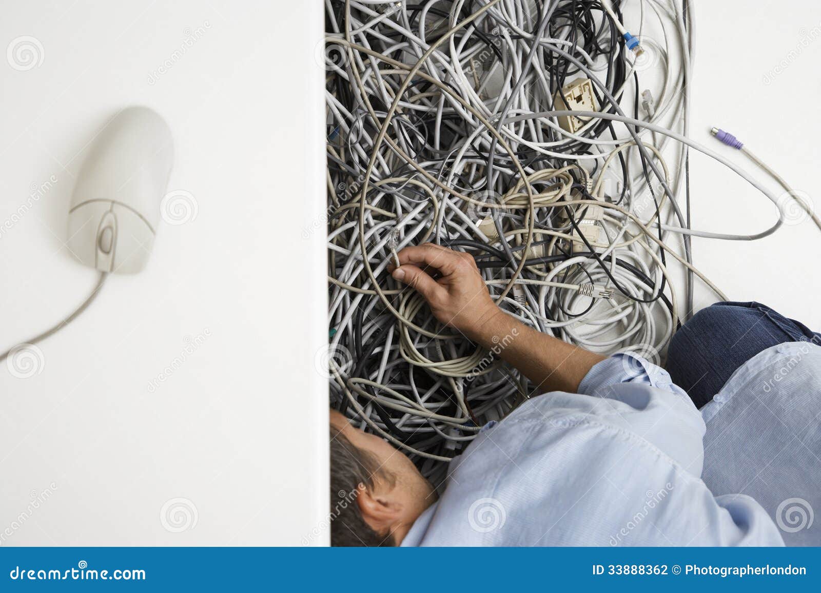 Man With Tangled Computer Wires Stock Photography - Image: 33888362