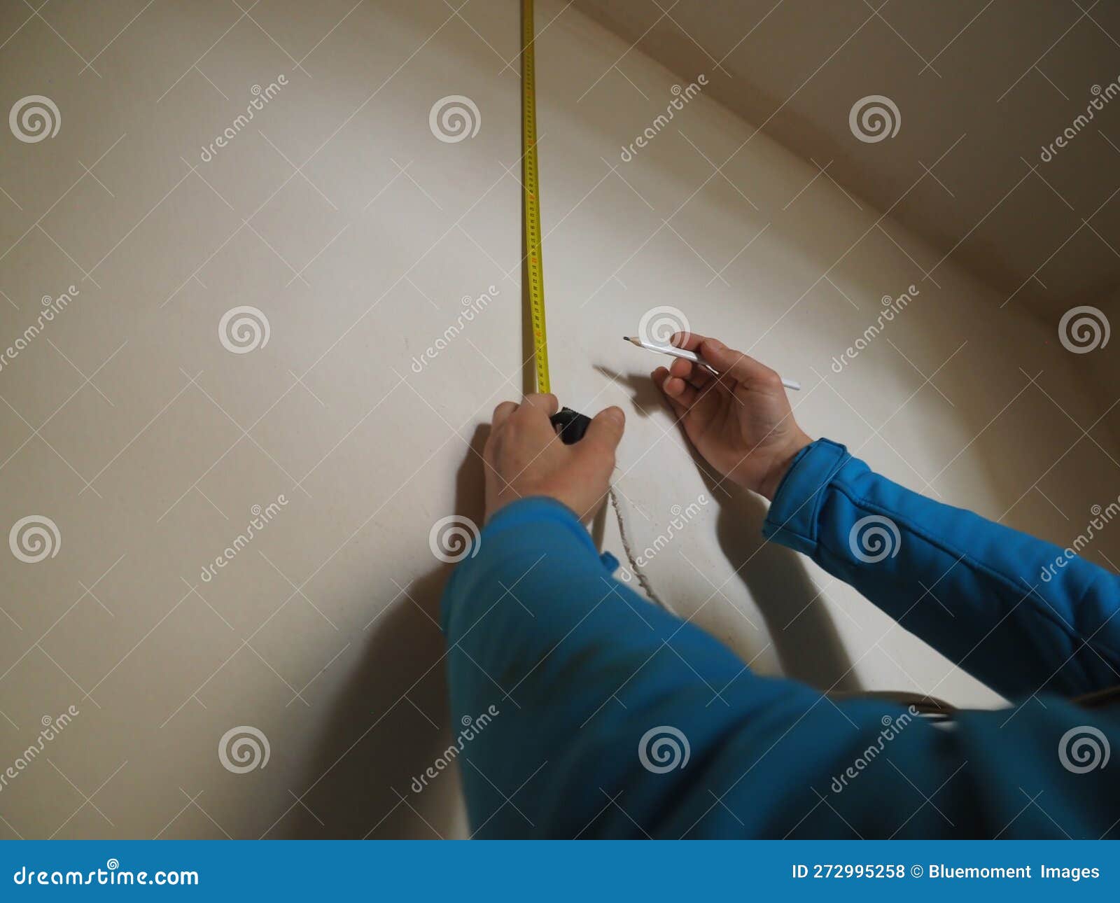 A Man with a Tape Measure and a Pen Stock Photo - Image of measuring ...