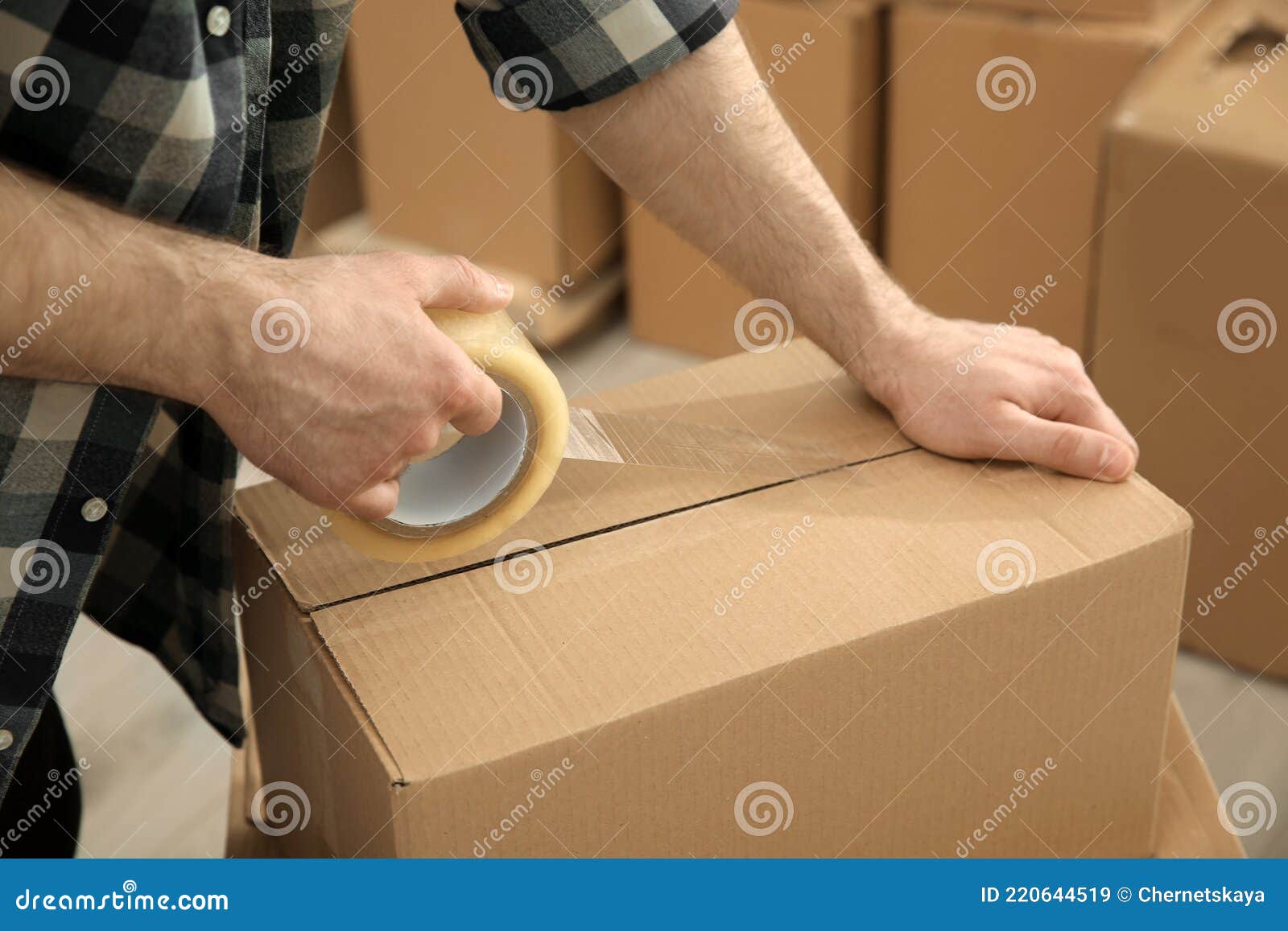 Man Taping Cardboard Box Indoors, Closeup View Stock Image - Image of ...