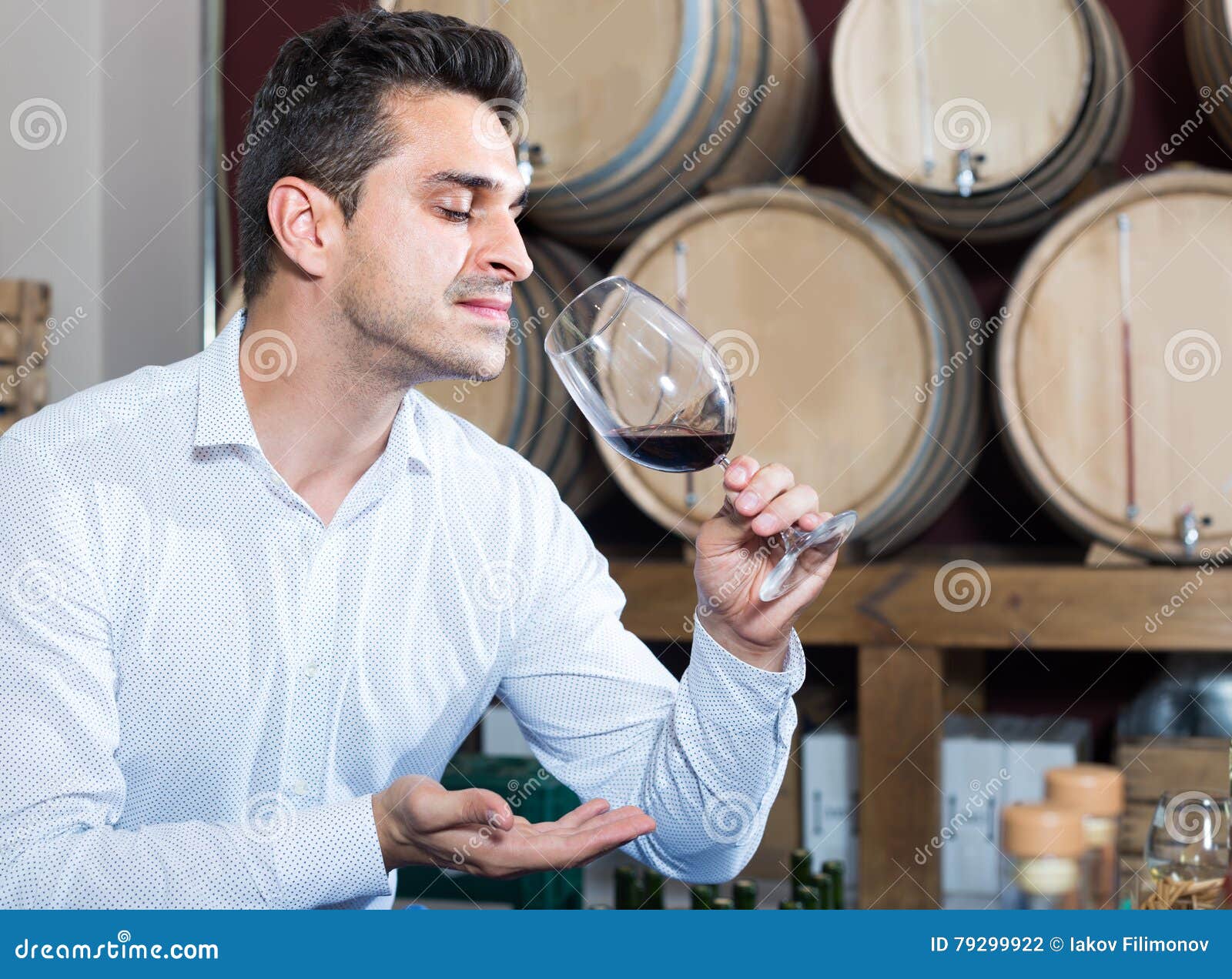 Man tasting wine in cellar stock photo. Image of cellar - 79299922