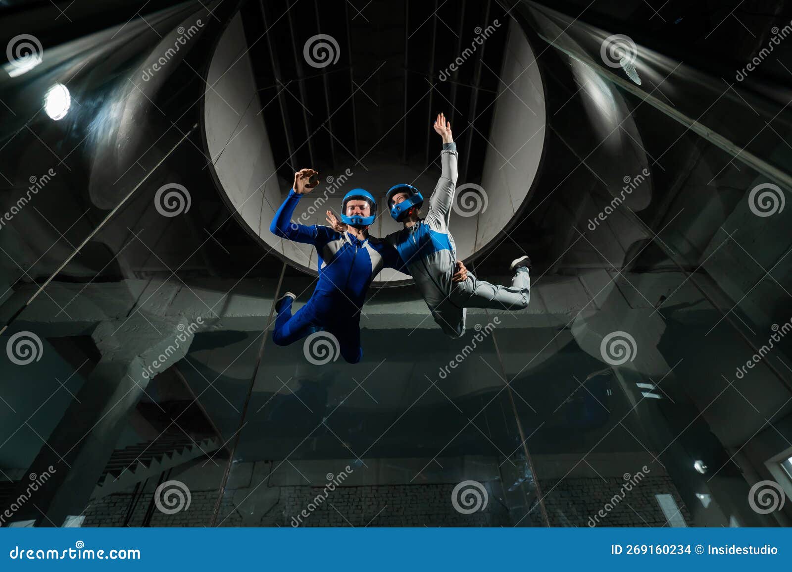 A Man Teaches a Boy To Fly in a Wind Tunnel. Stock Photo - Image of ...