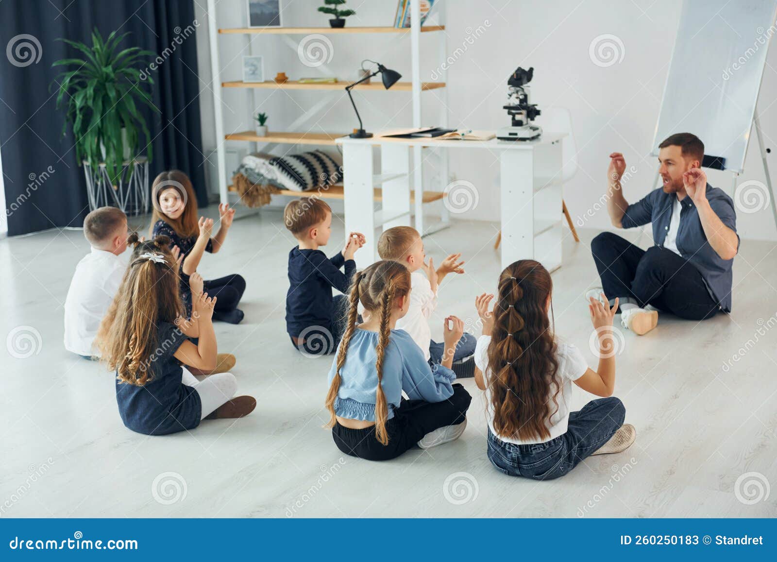Man Teaches Gesture Language. Group of Children Students in Class at ...