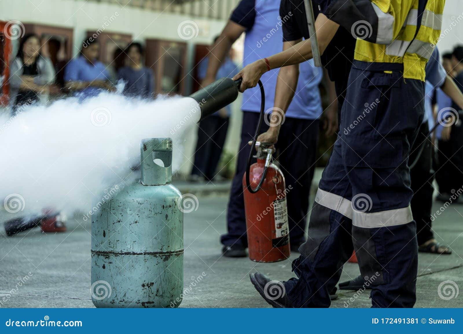 Man Teaches How To Use Fire Extinguisher To Extinguish Fire Stock Image ...