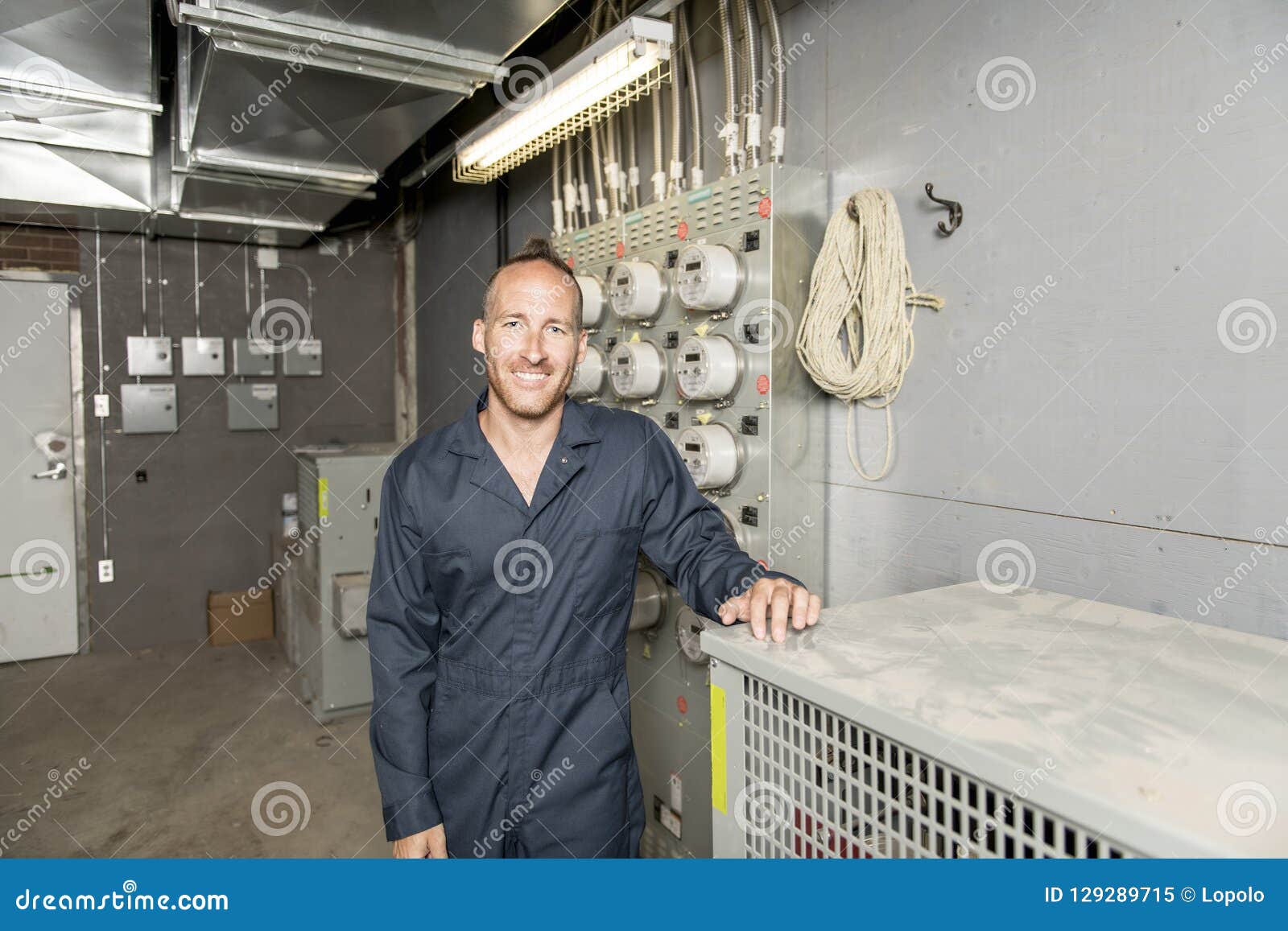 Man Technician Servicing at Work on Electric Room Stock Image - Image ...