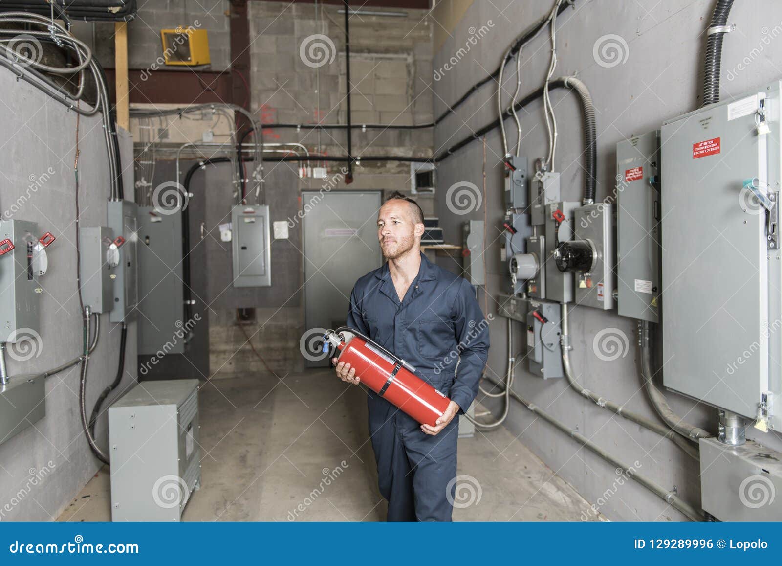 Man Technician Servicing at Work on Electric Room Stock Photo - Image ...