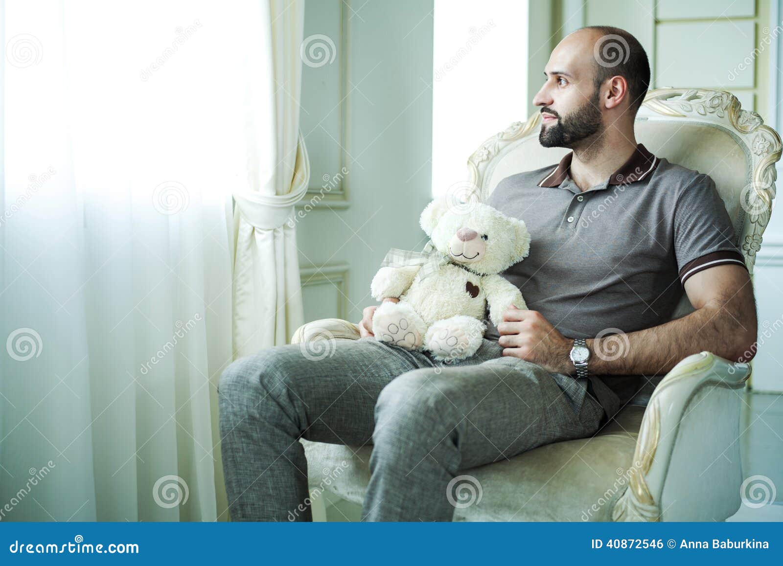 Man with teddy bear stock photo. Image of cuddle, armchair - 40872546