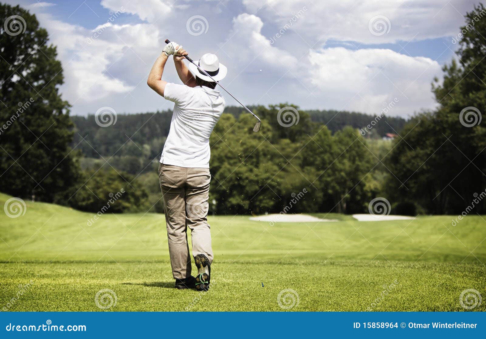 Man teeing-off golf ball. stock photo. Image of playing - 15858964
