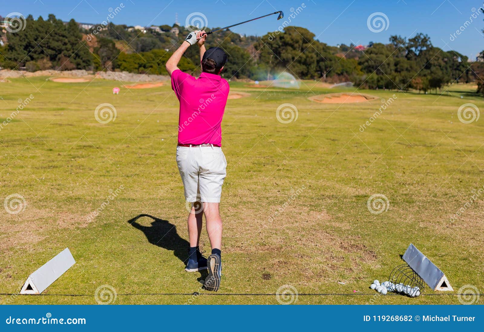 Man Teeing Off on a Golf Course with a Driver Editorial Photography ...