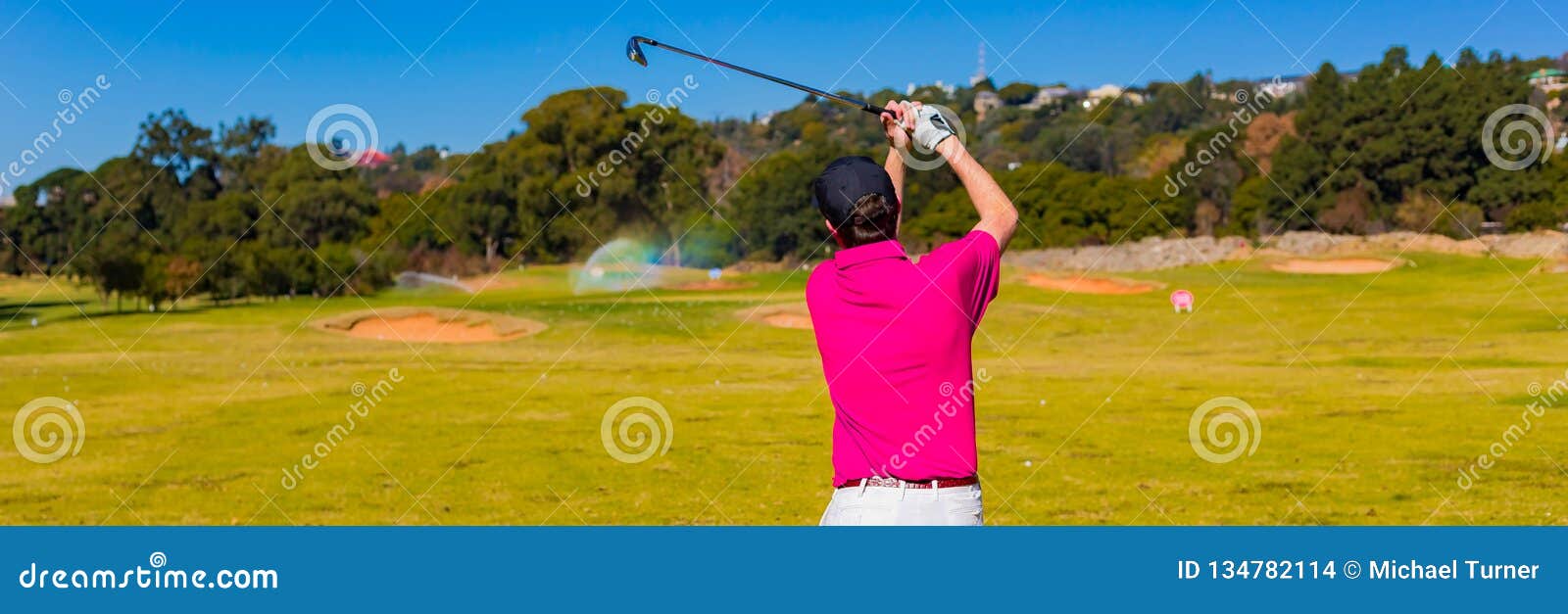 Man Teeing Off on a Golf Course with a Driver Editorial Stock Image ...