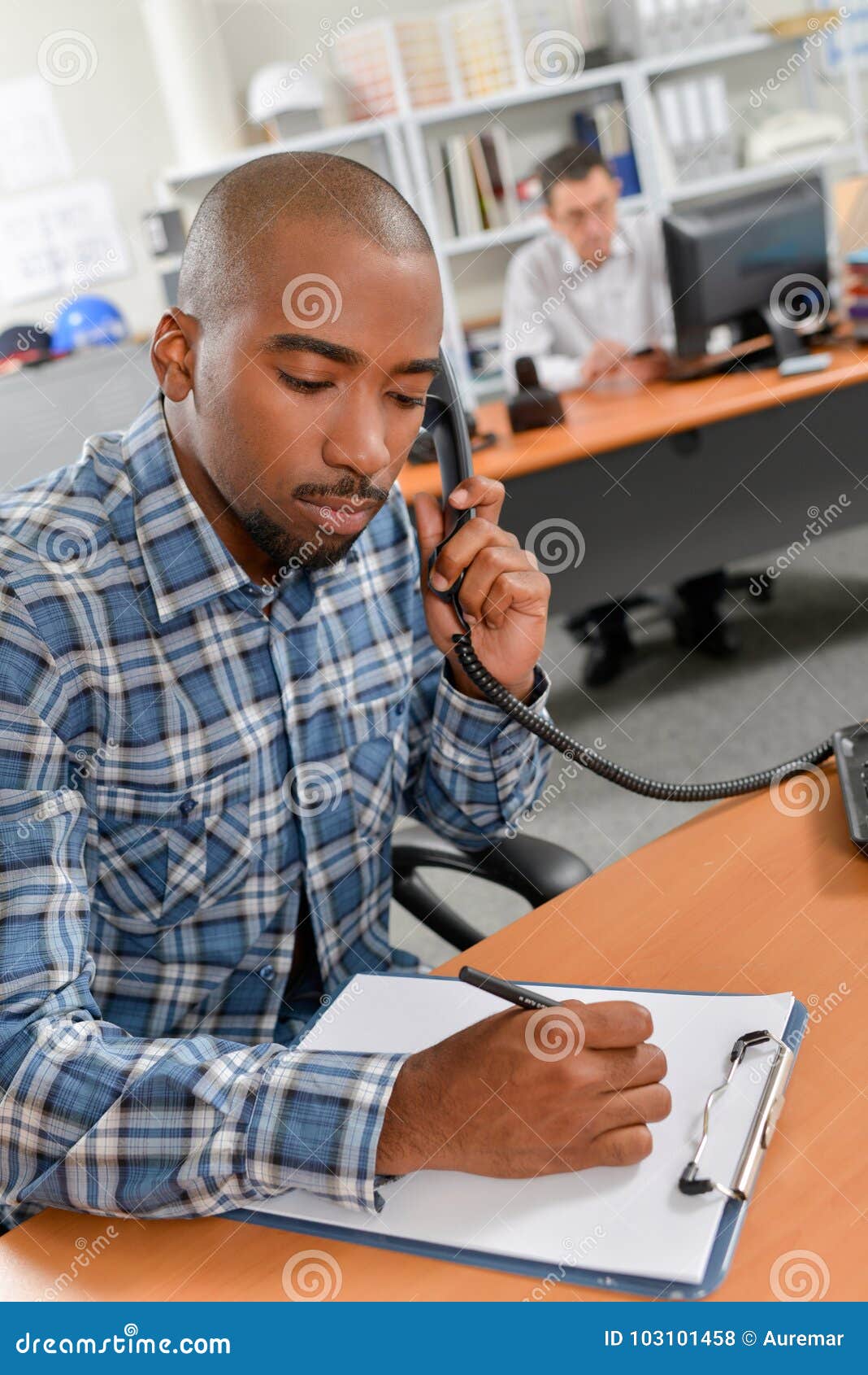 Man on Telephone Making Notes on Clipboard Stock Photo - Image of ...