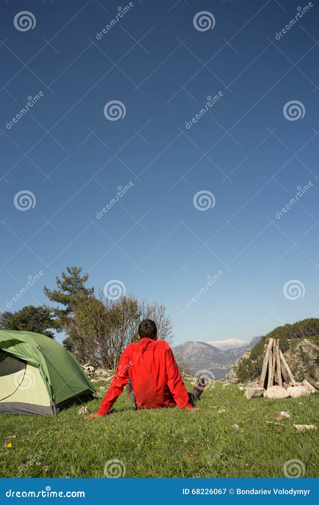 Man with tent camping. stock image. Image of mountains - 68226067
