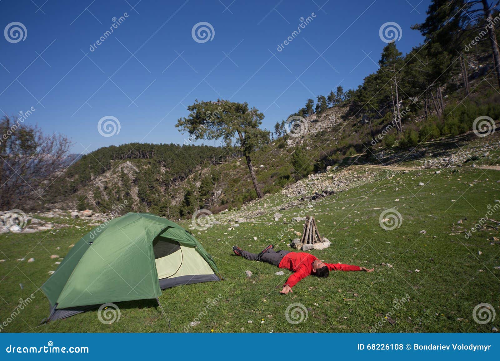 Man with tent camping. stock photo. Image of autumn, cliff - 68226108