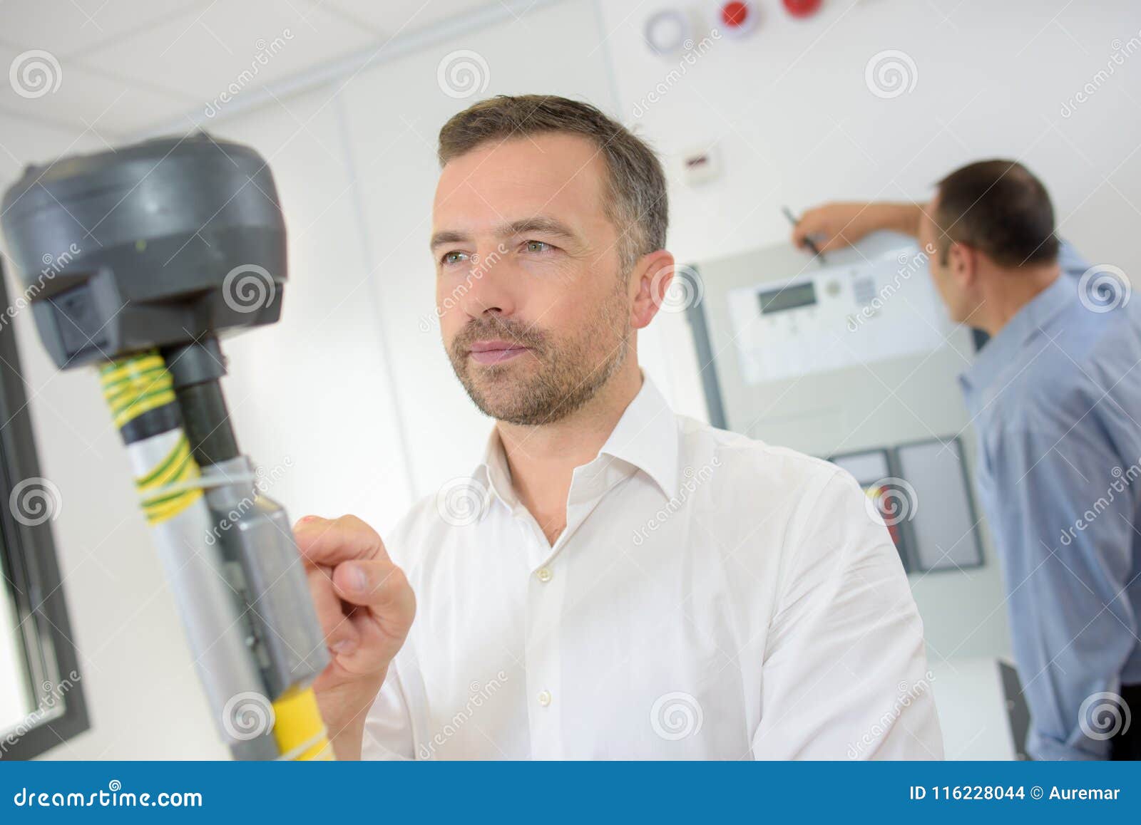 Man Testing Electrical Equipment Stock Photo - Image of monitor, device ...