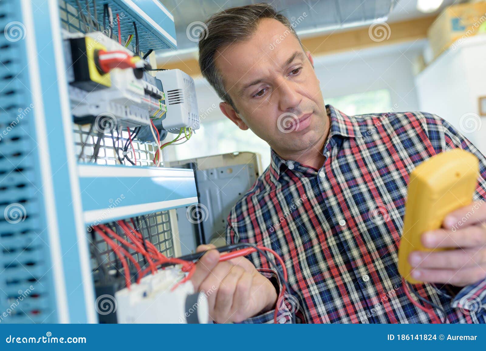 Man Testing Electronic System with Multimeter Stock Photo - Image of ...