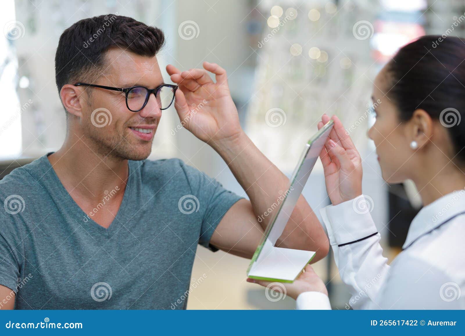 Man Testing Glasses in Optician Shop Mirror Stock Photo - Image of ...