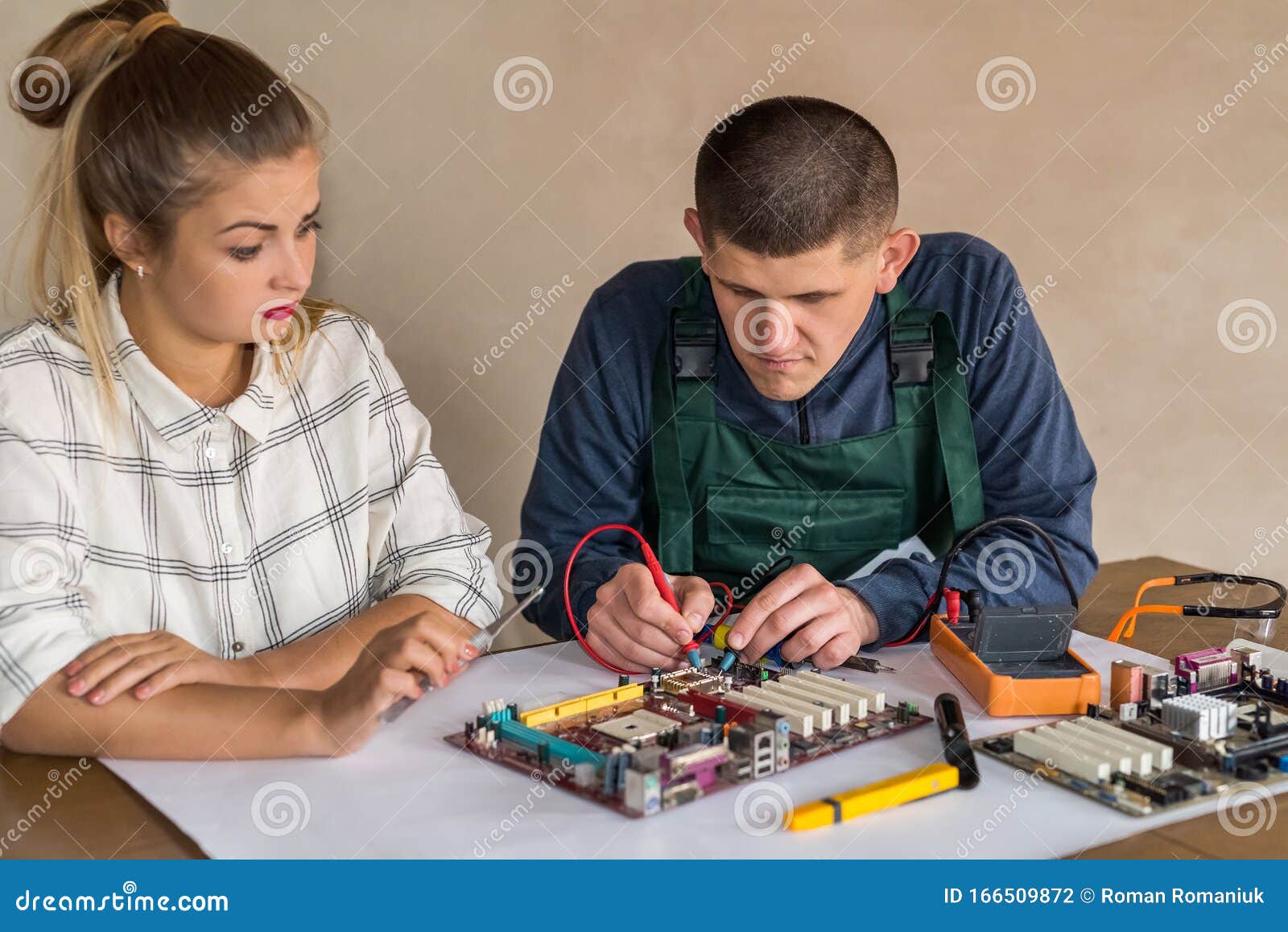 Man Testing Motherboard of Personal Computer by Multimeter Stock Photo ...