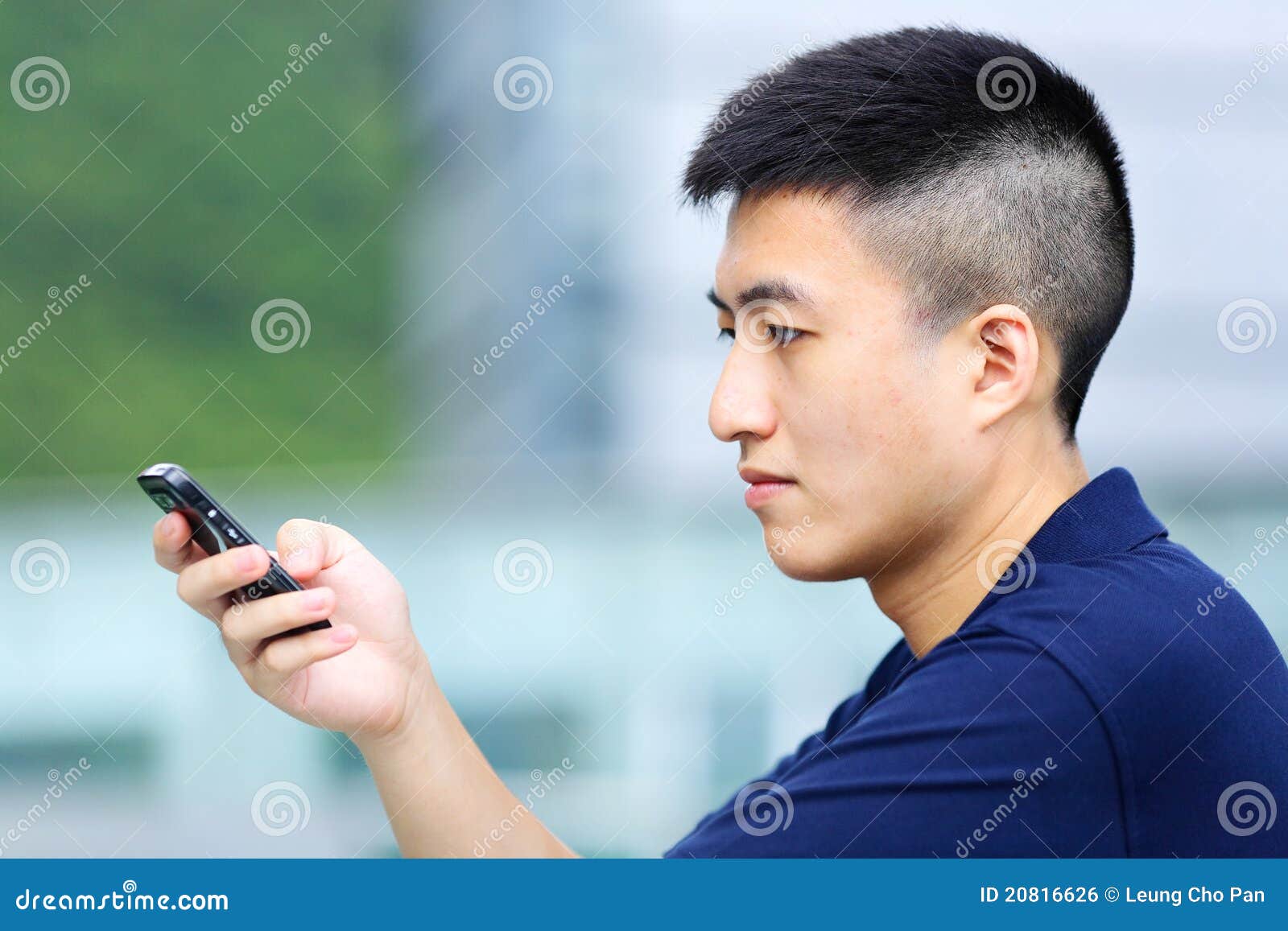 Man text message on phone stock photo. Image of asian - 20816626