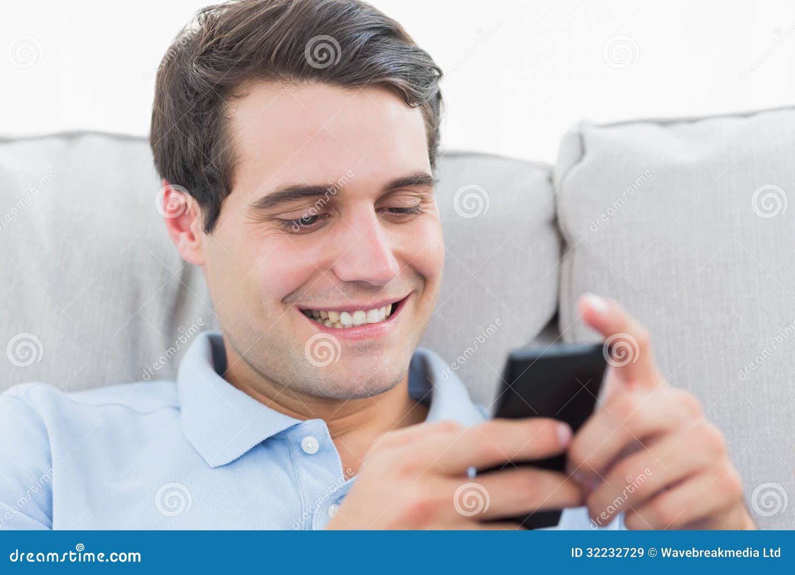 Man Text Messaging with His Phone Stock Image - Image of room, handsome ...