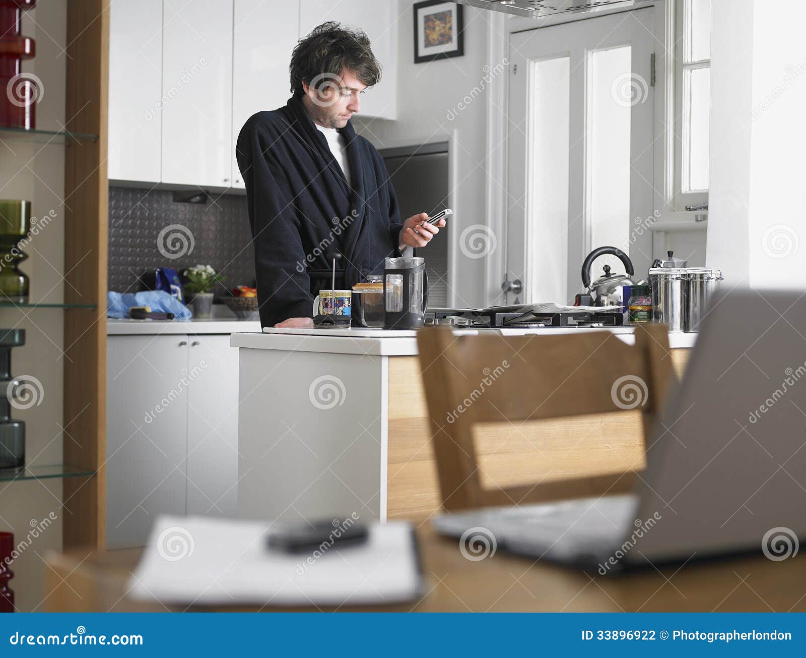 Man Text Messaging in Kitchen Stock Photo - Image of coffee, holding ...