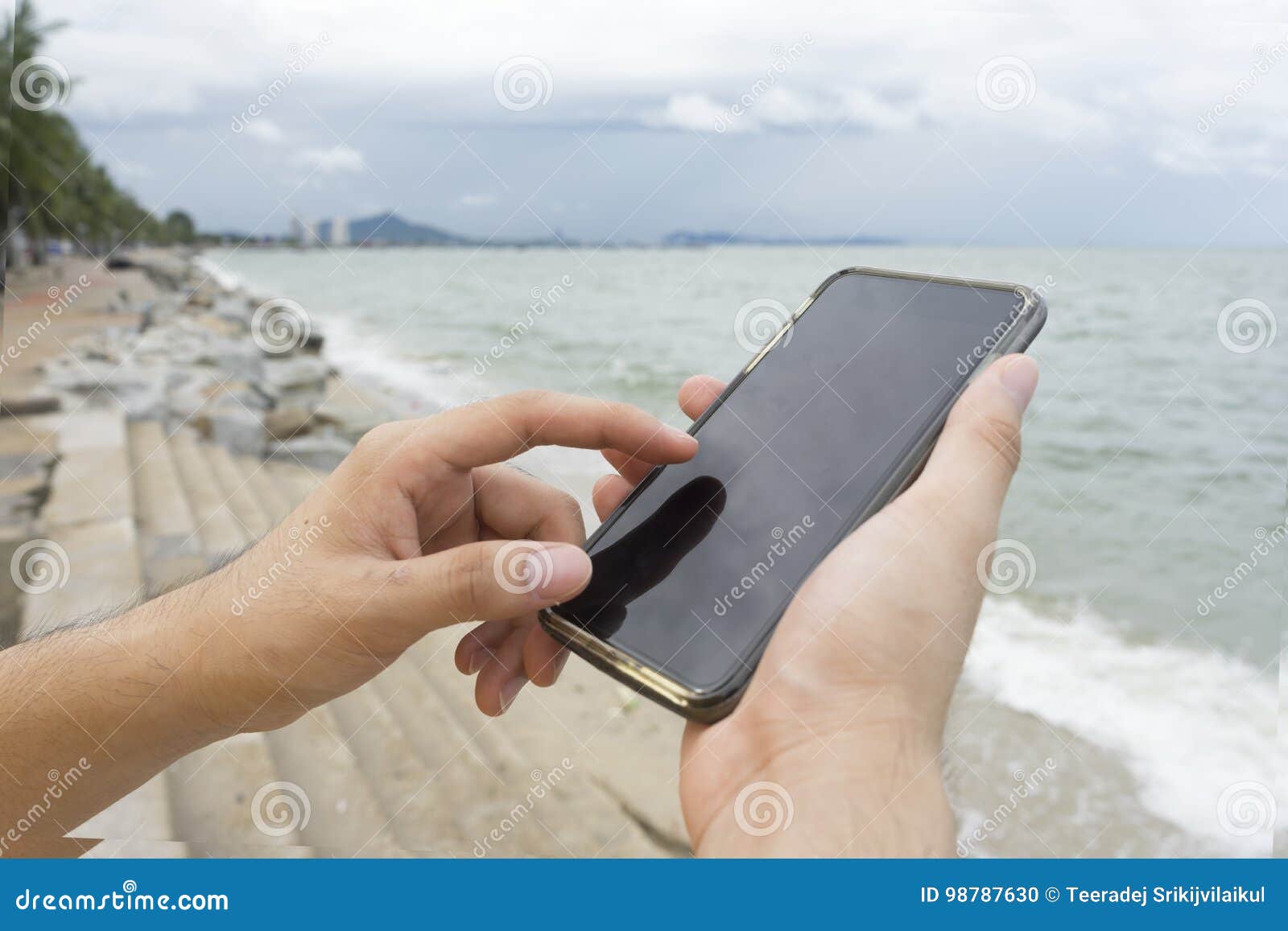 A Man Texting Cellphone on the Beach Stock Photo - Image of internet ...