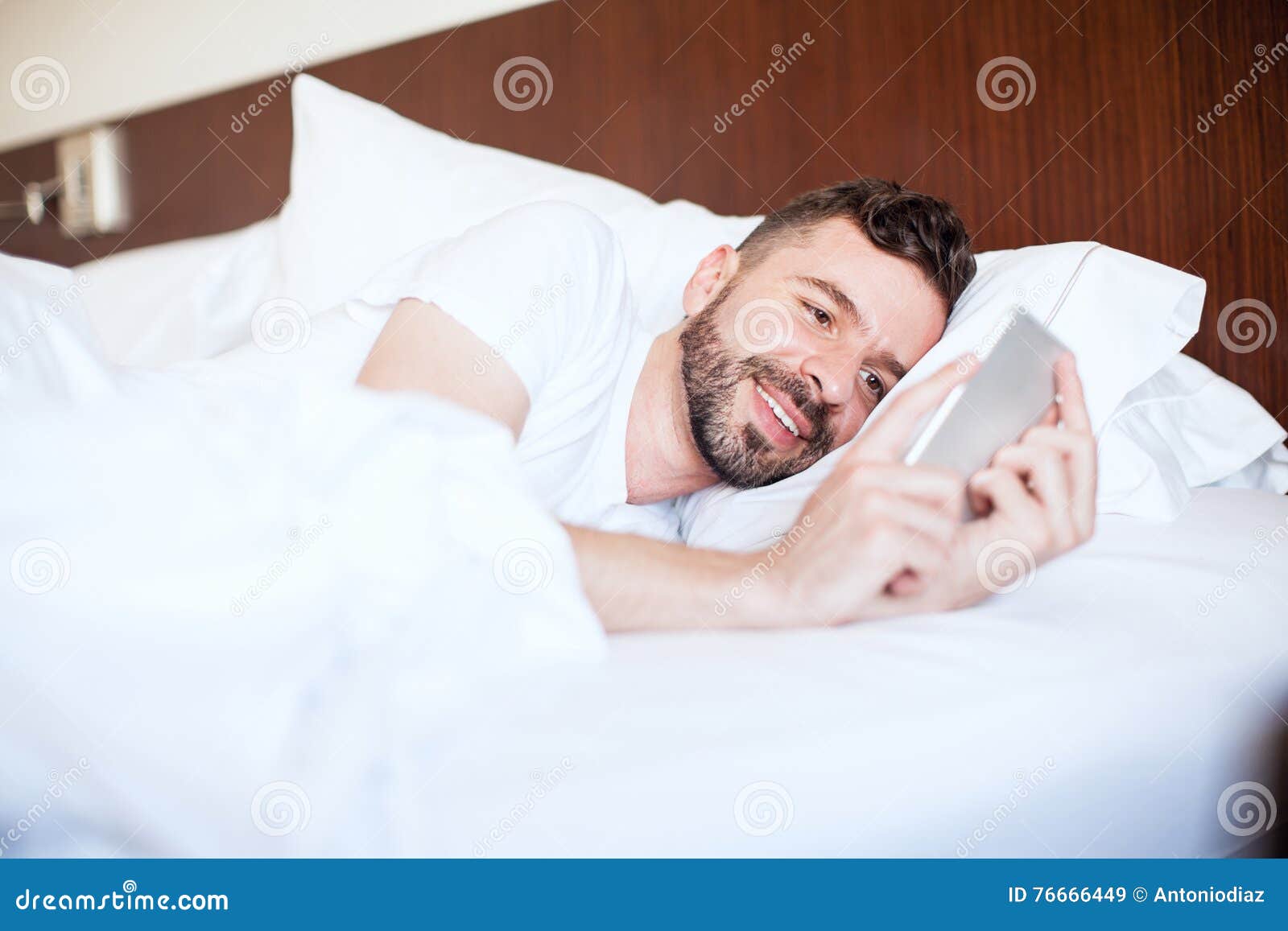 Man Texting His Girlfriend in Bed Stock Image - Image of beard ...