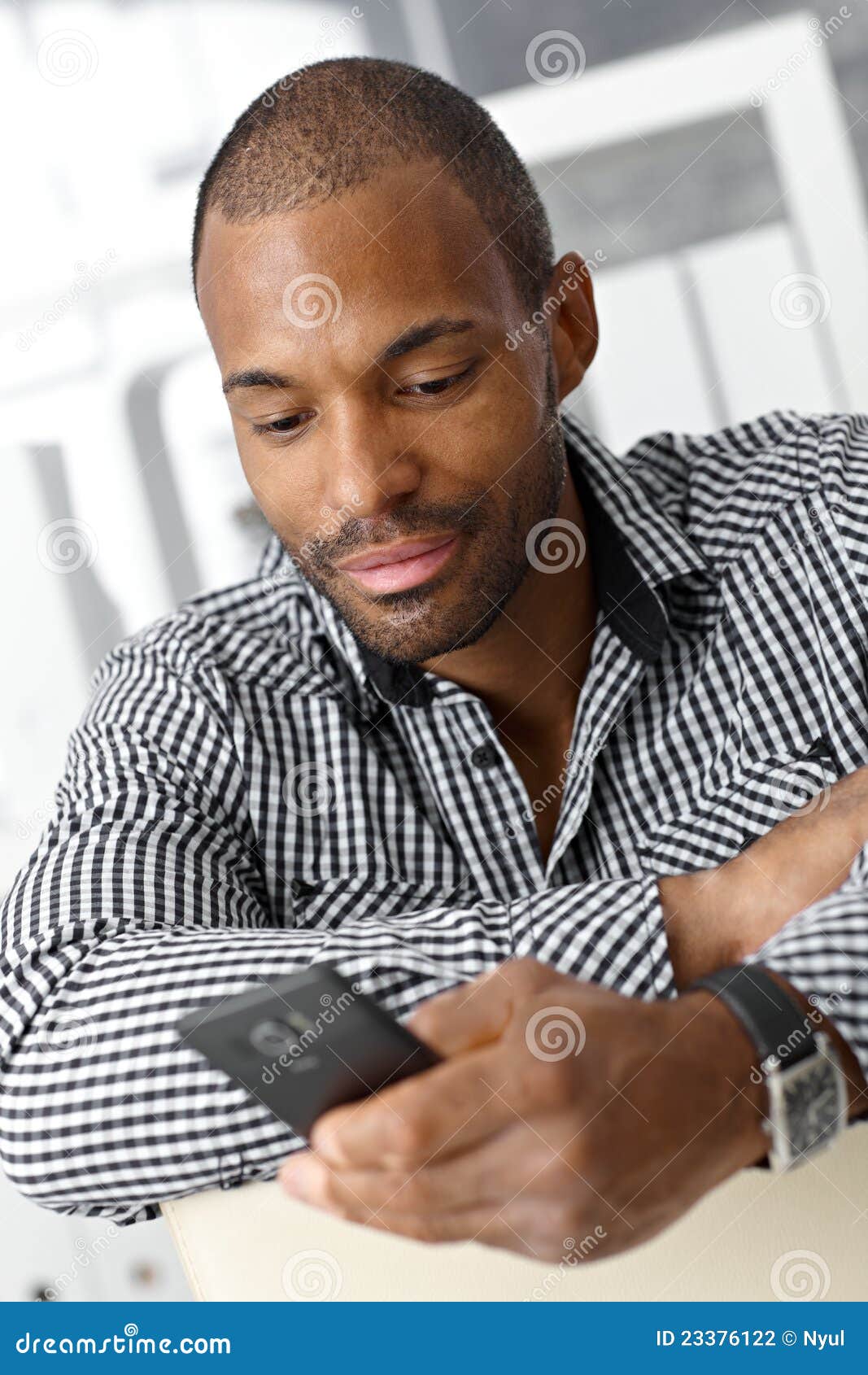 Man Texting on Mobile Phone Stock Photo - Image of goodlooking ...