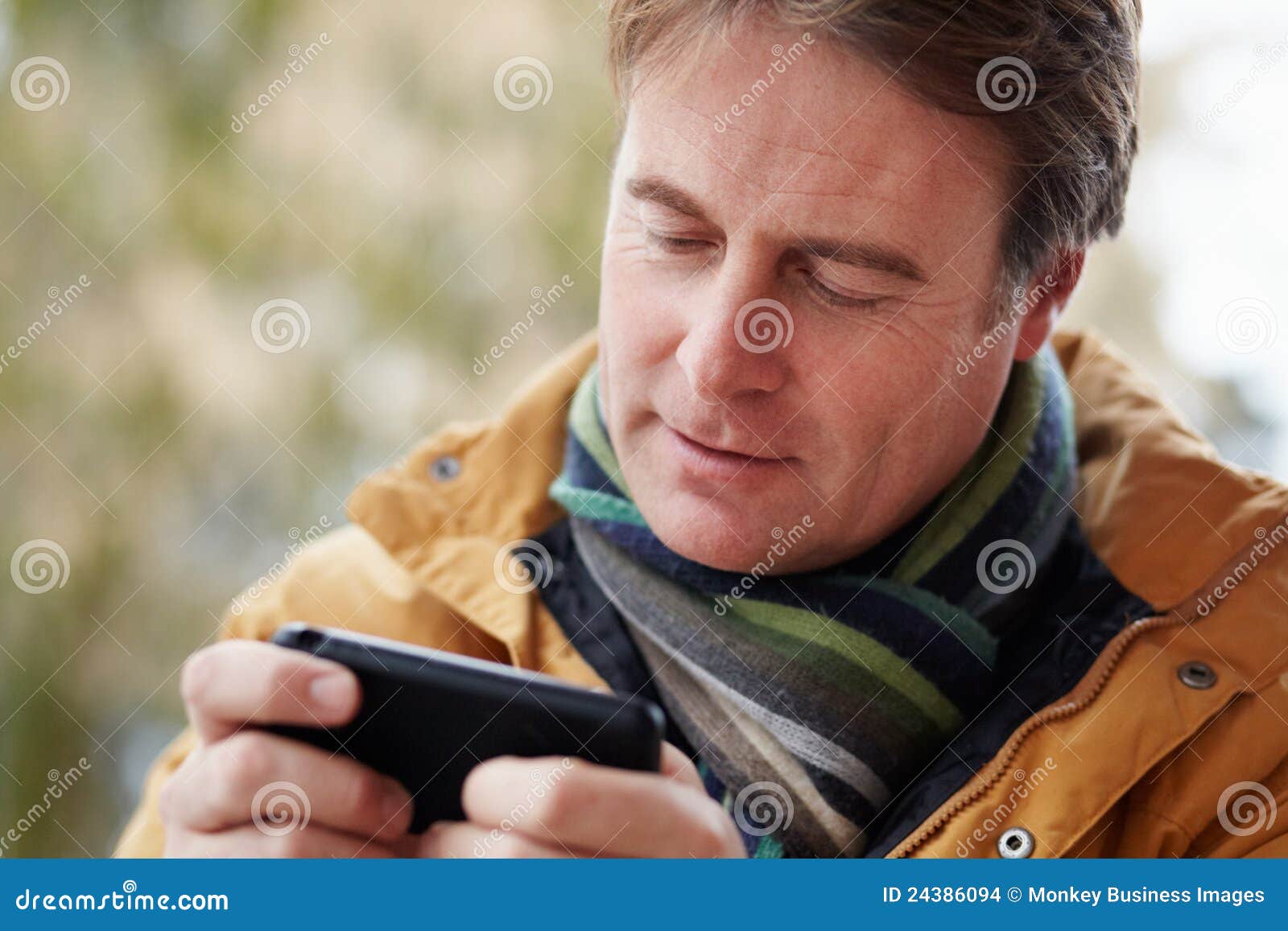 Man Texting on Smartphone Wearing Winter Clothes Stock Photo - Image of ...