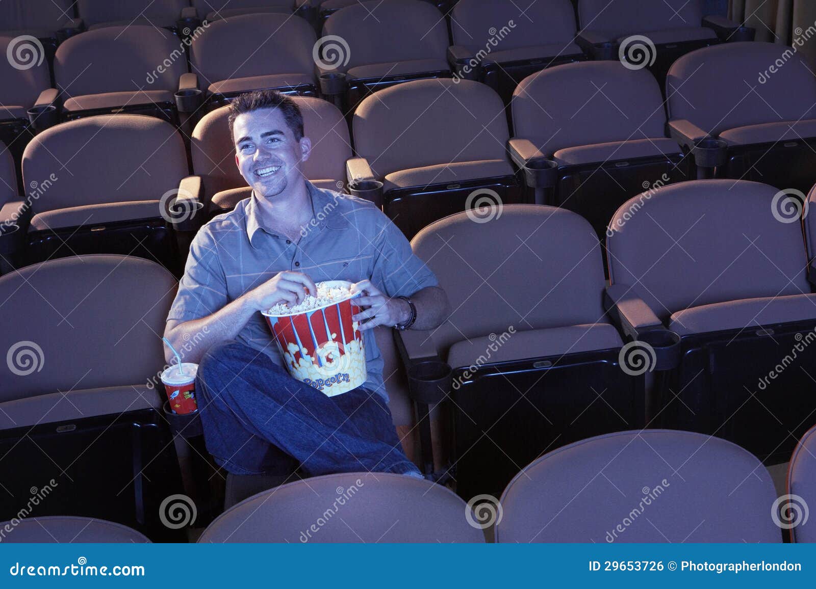 Man in Theater Watching Movie Stock Photo - Image of caucasian, indoors ...