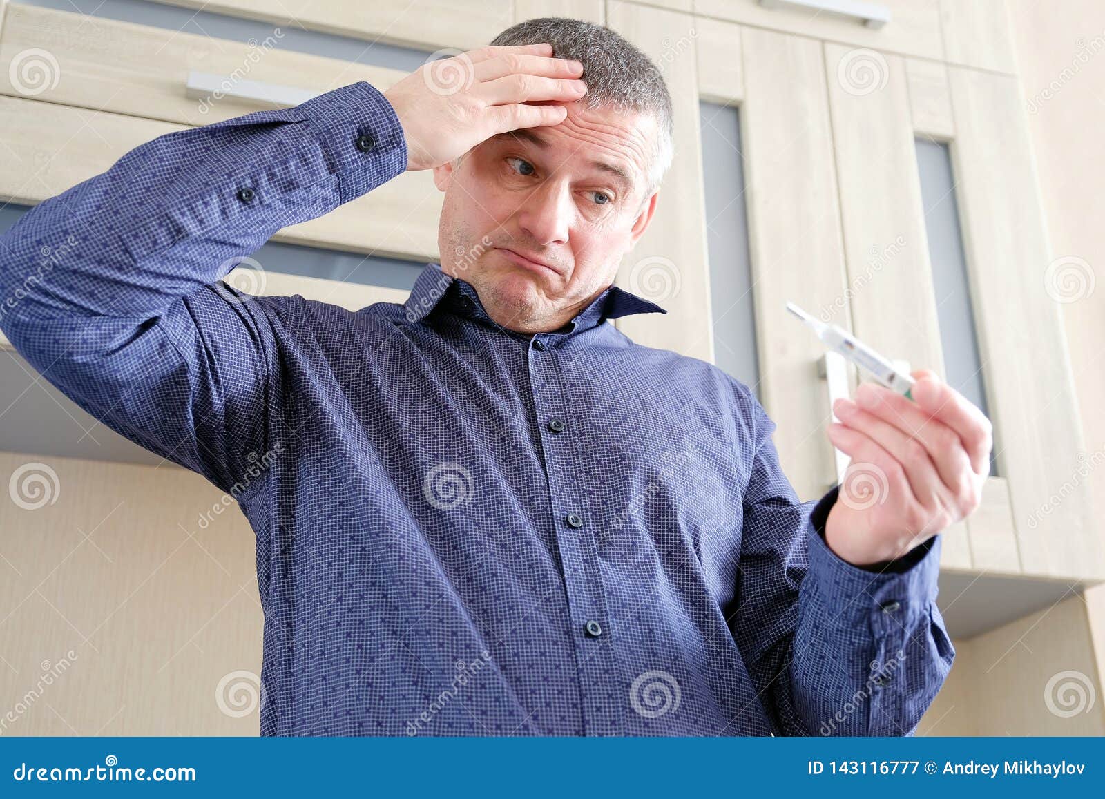 Man With A Thermometer In His Hand Increased Body Temperature Stock
