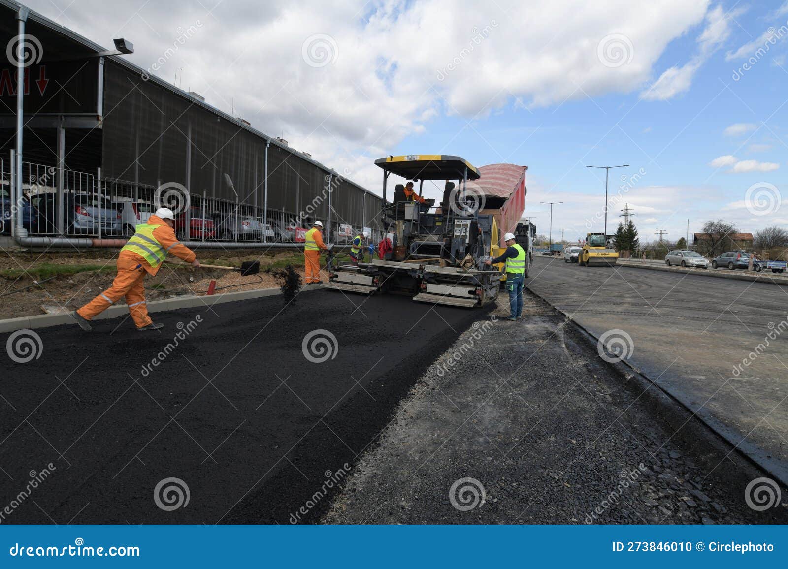 A Man Throwing Asphalt Behind a Paver Editorial Image - Image of ...