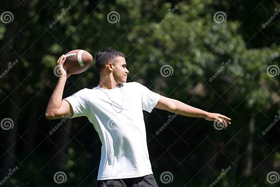 Man Throwing a Football stock image. Image of adult, american - 10769231